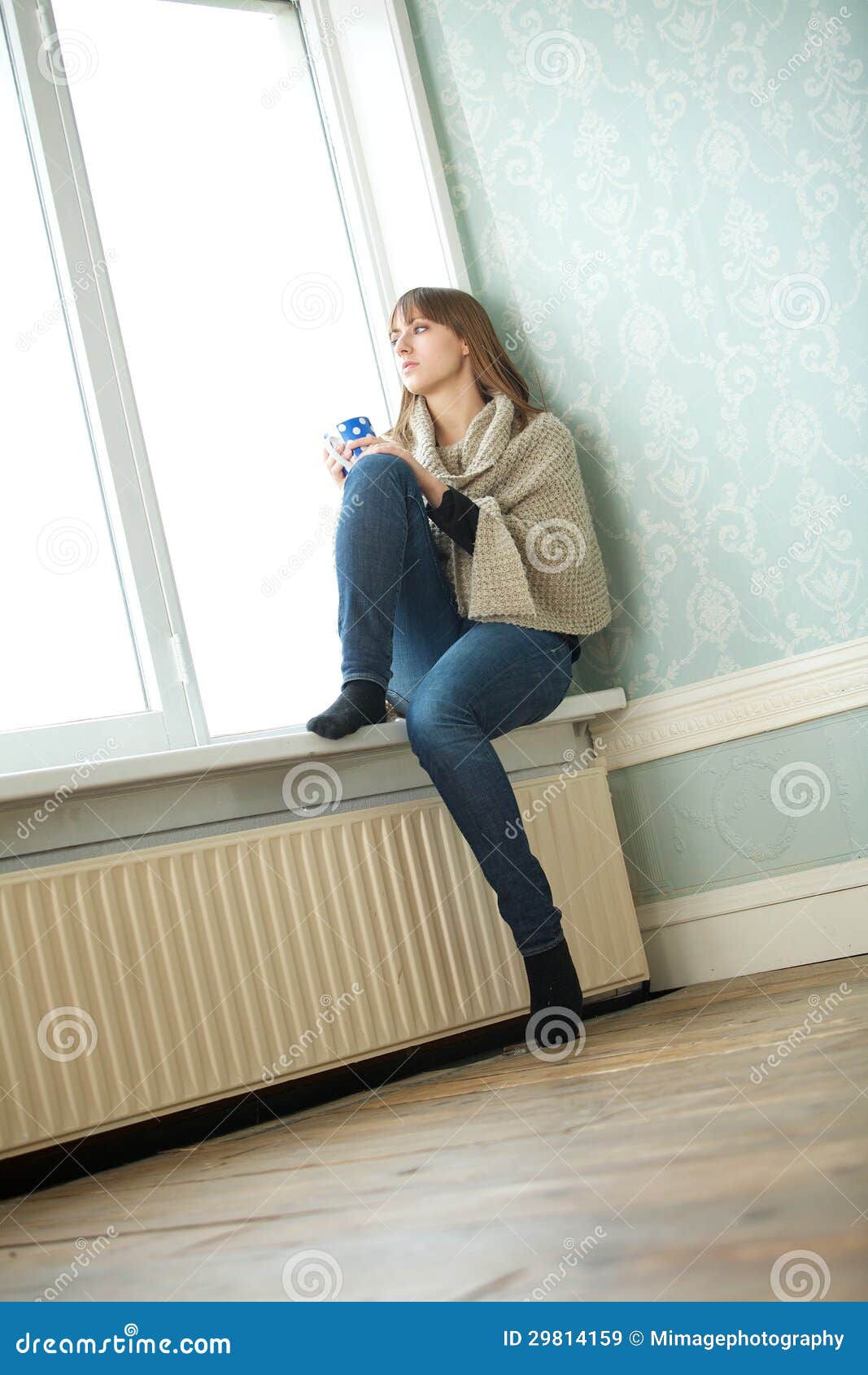 Young Woman Sitting in Empty Room Stock Image - Image of drink, girl ...