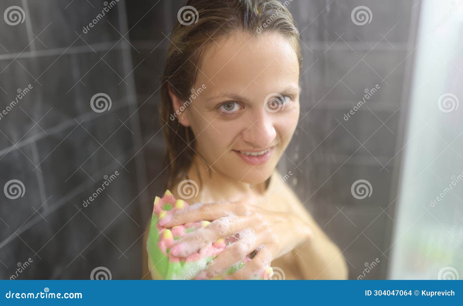 Young Woman Take Hot Shower After Hard Day Cleansing With Washcloth