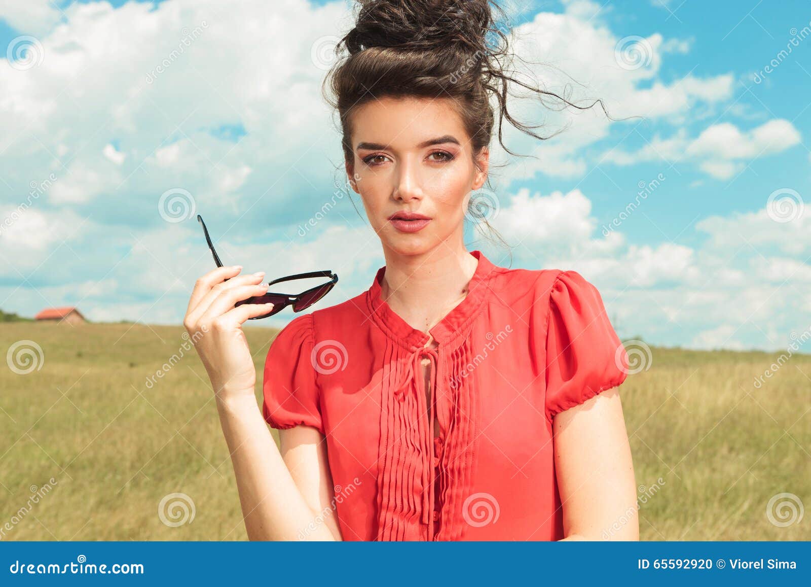 Portrait of Young Woman Taking Off Her Sunglasses Stock Photo - Image ...