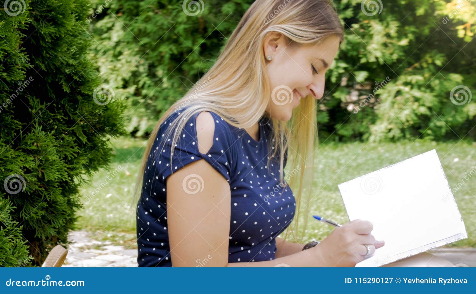 Portrait of Young Woman Writing in Diary at Park Stock Image - Image of ...