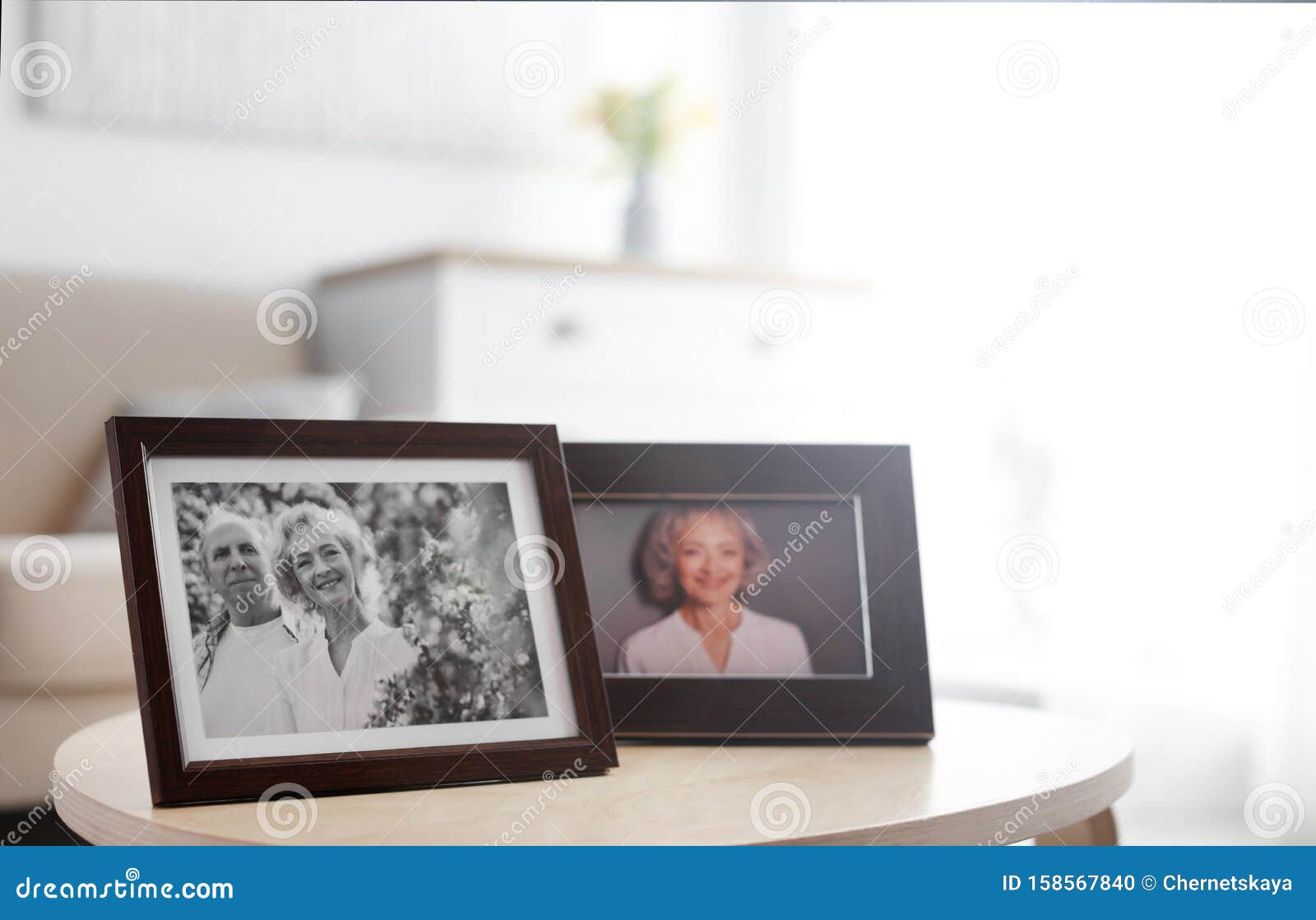 Portraits in Stylish Frames on Table Stock Photo - Image of framed ...
