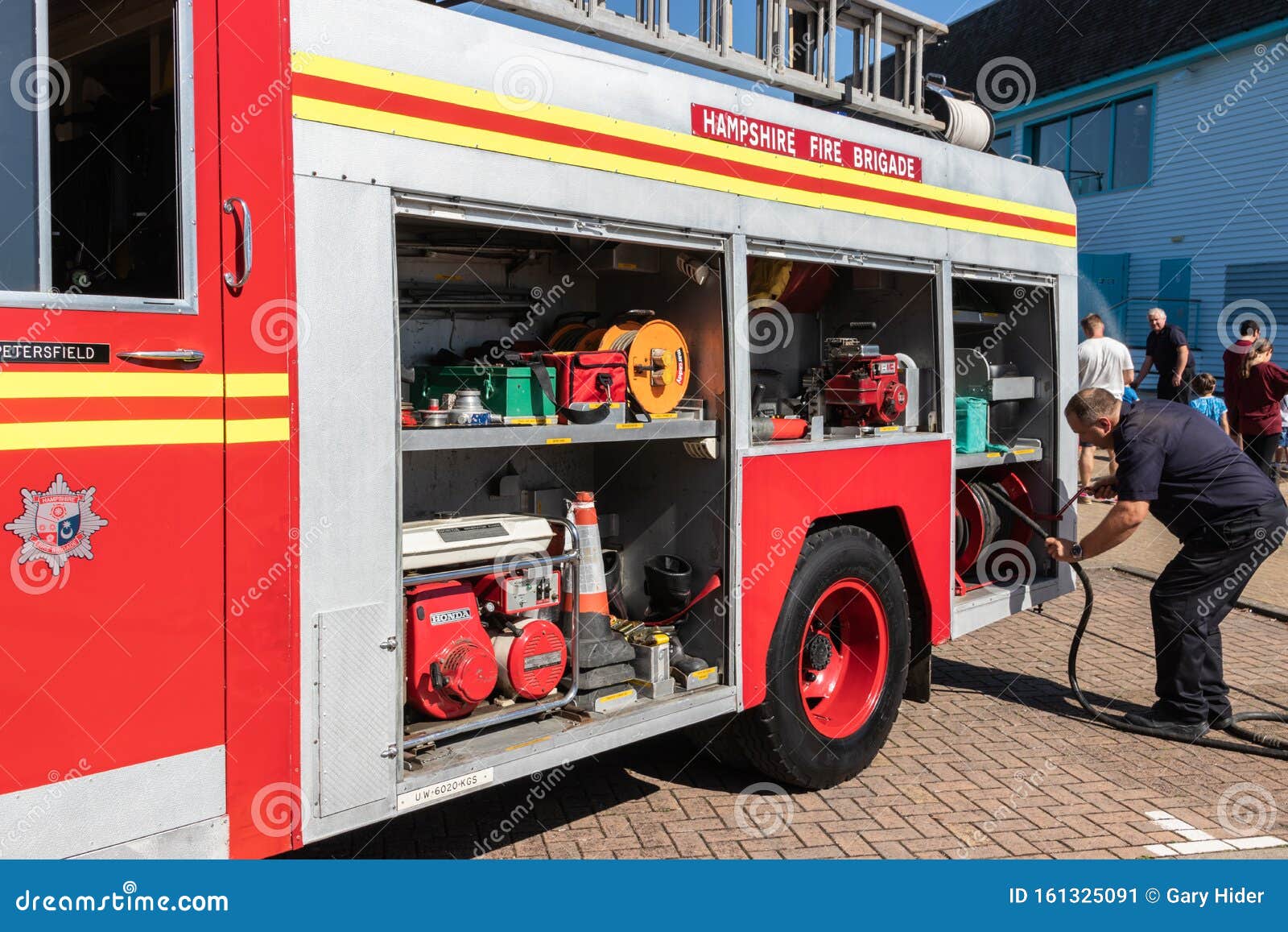 09/14/2019 Portsmouth, Hampshire, UK a British Firefighter Pulling a ...