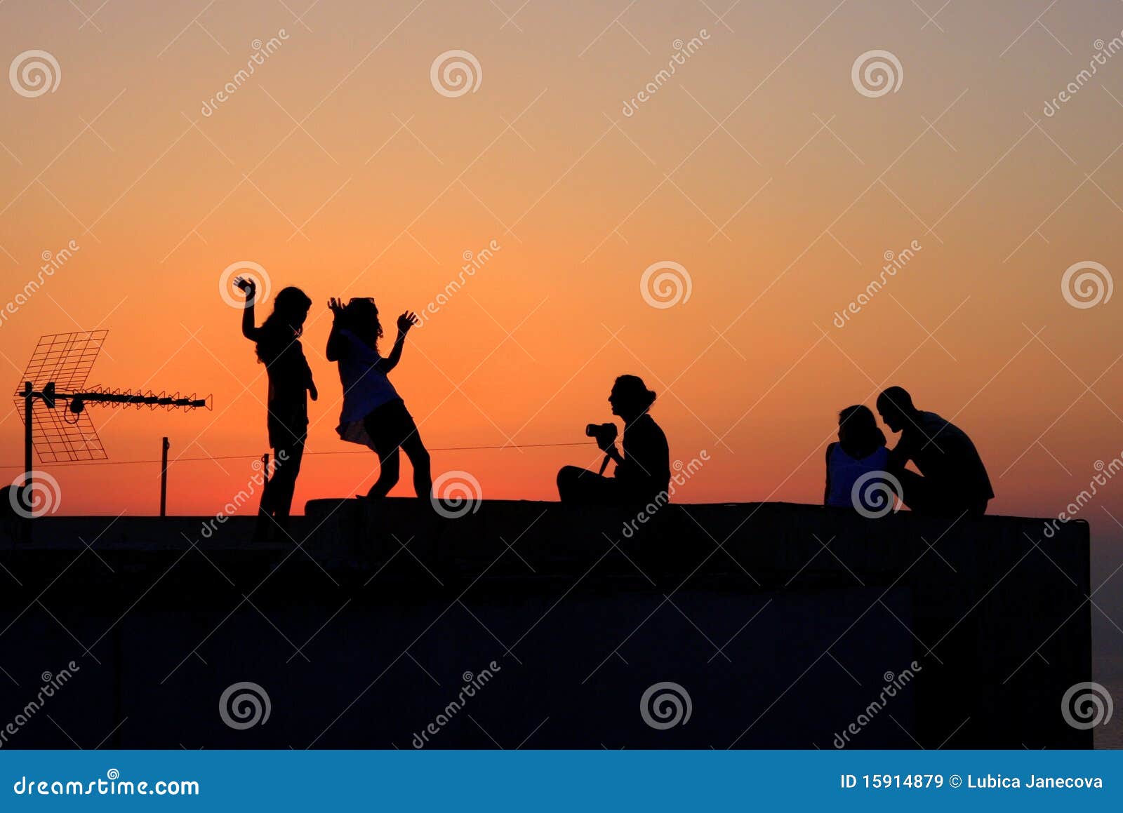 Poses on the roof stock image. Image of photographer - 15914879