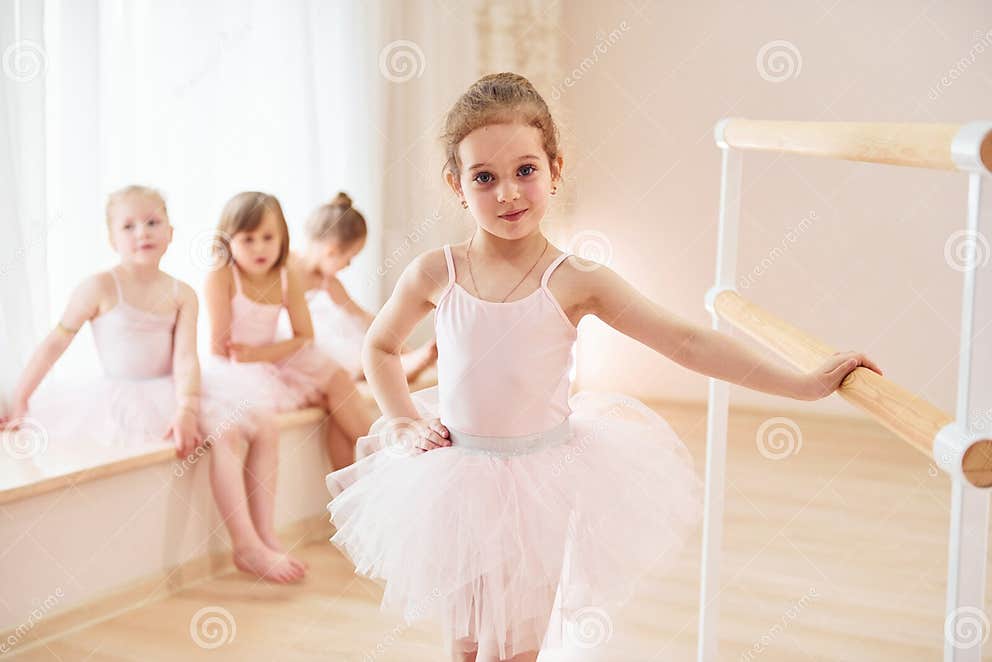 Posing for a Camera. Little Ballerinas Preparing for Performance Stock ...