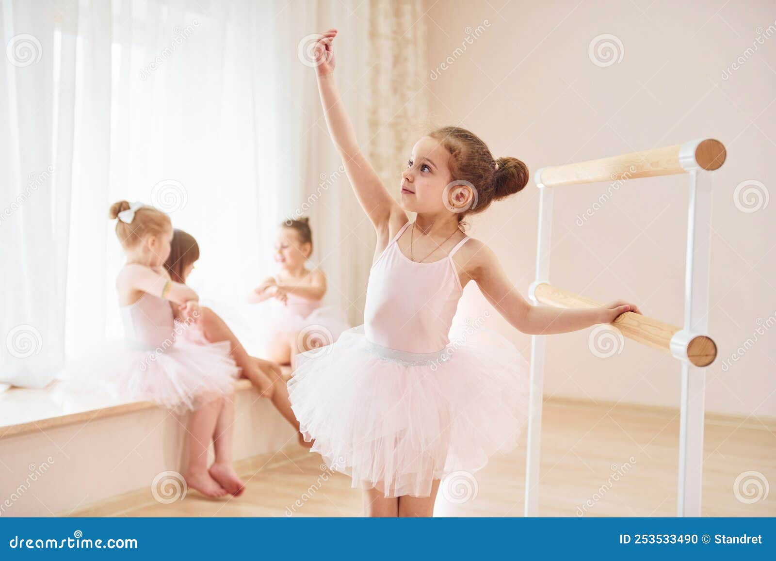 Posing for a Camera. Little Ballerinas Preparing for Performance Stock ...