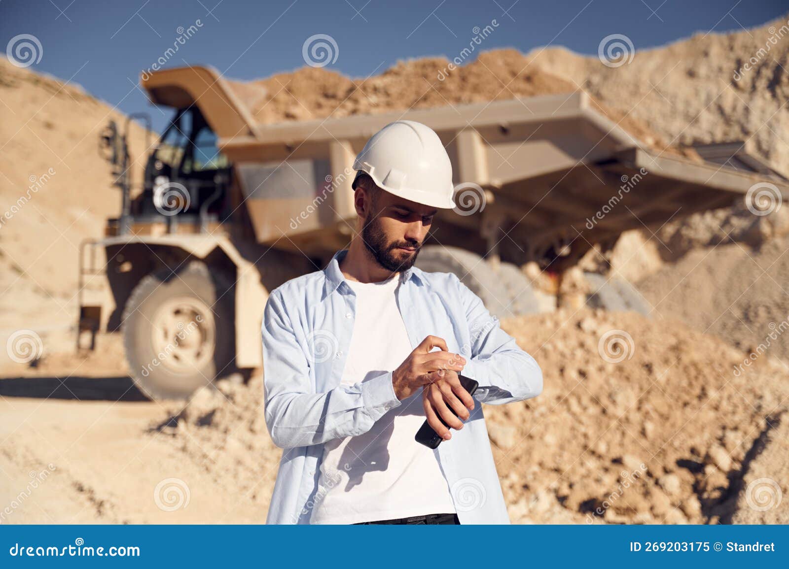 Posing for a Camera. Man in Uniform is Working in the Quarry at Daytime ...