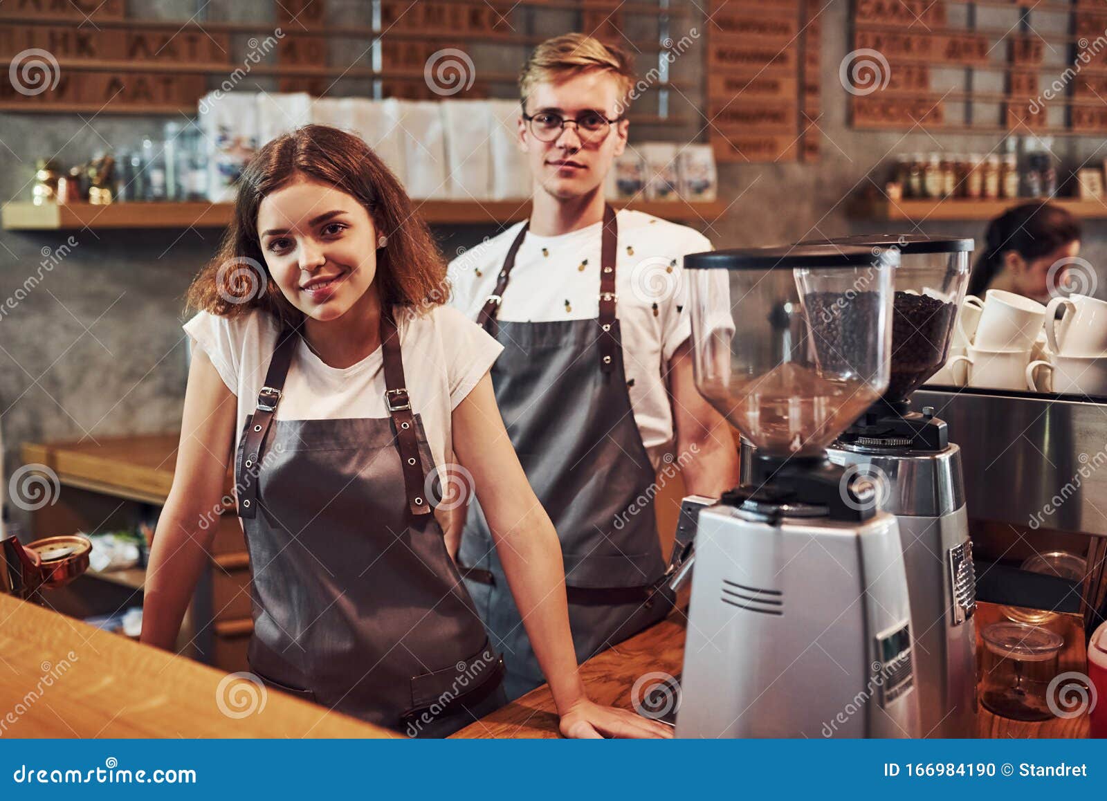 Posing for the Camera. Two Young Cafe Workers Indoors Stock Photo ...
