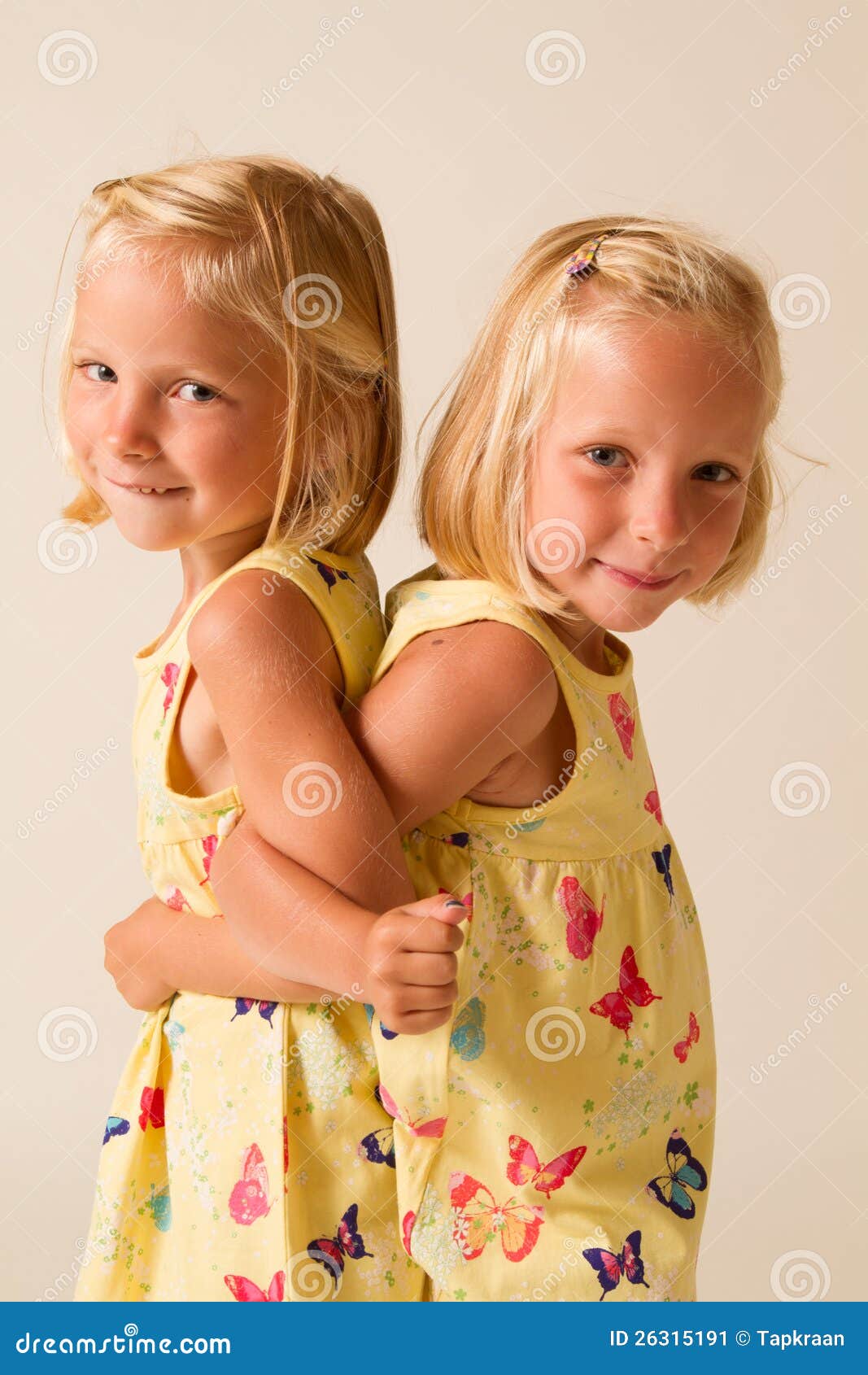 Posing twins stock image. Image of back, blond, happy - 26315191