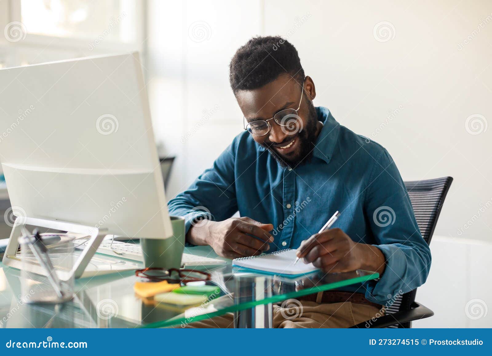 Positive Black Executive Ceo Manager Writing Notes in Notebook, Sitting ...