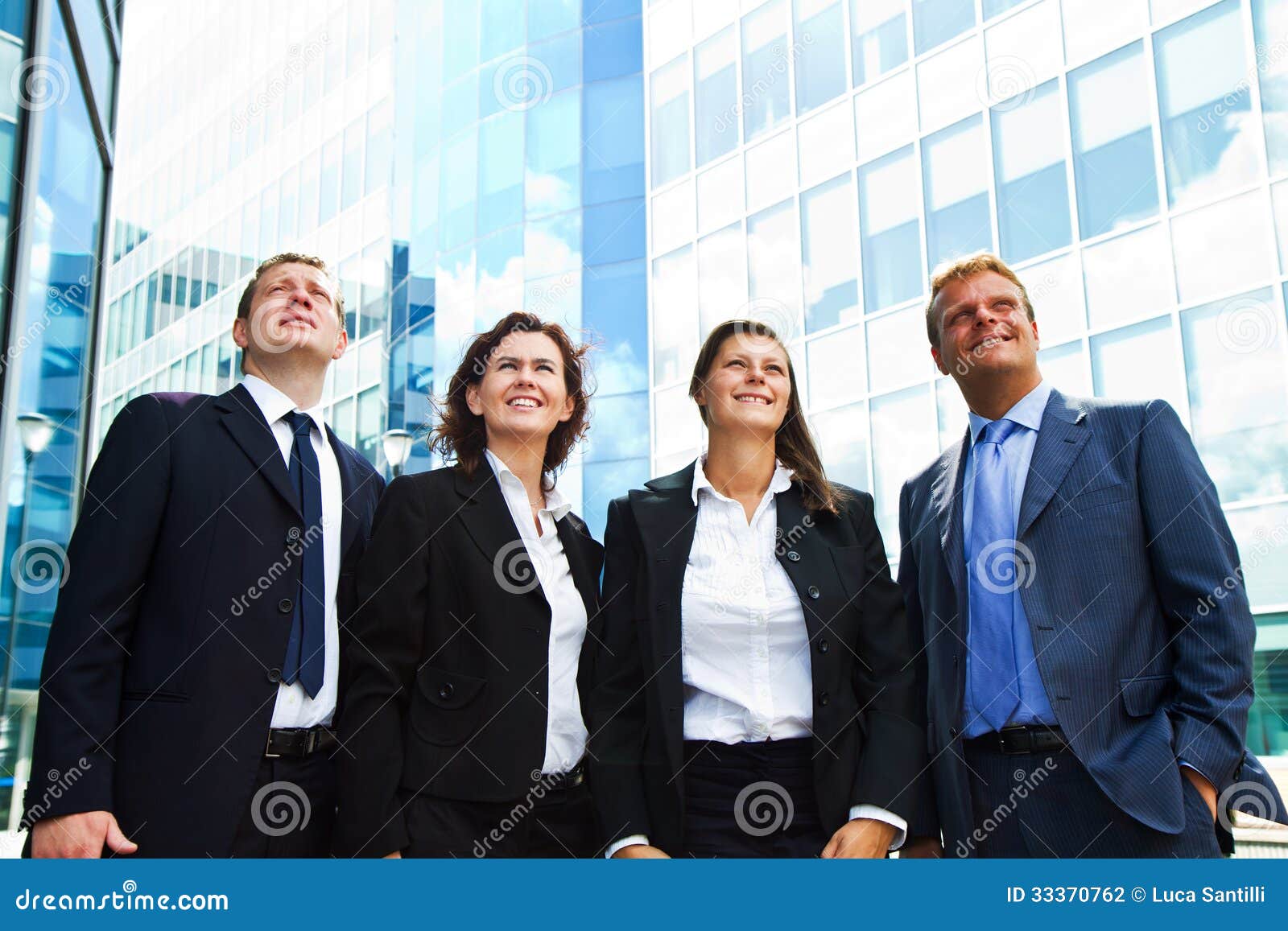 Positive Business Group Looking Up with Dreaming Expressio Stock Photo ...