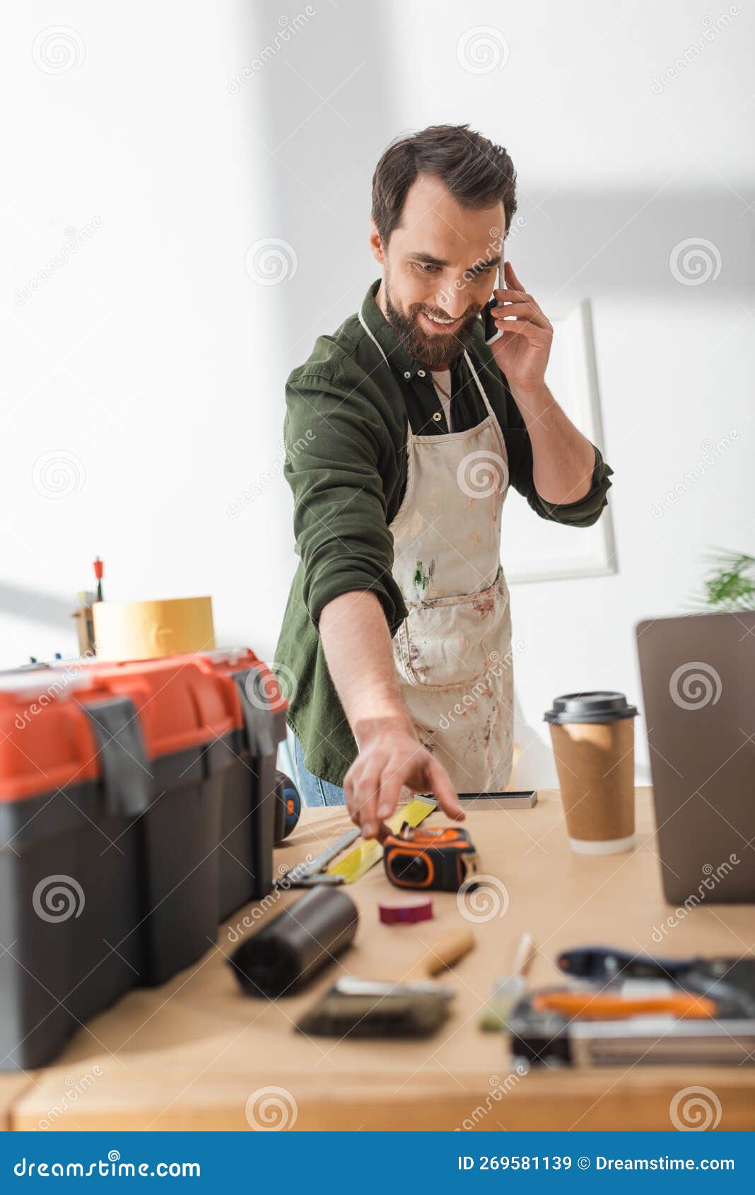 Positive Carpenter Talking on Smartphone and Stock Image - Image of ...