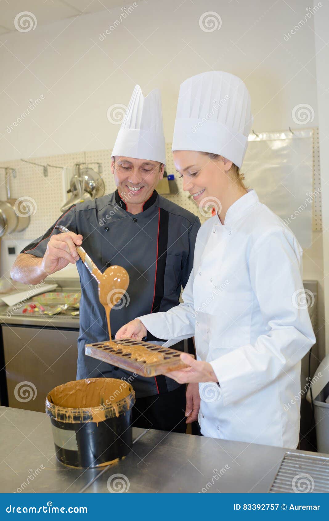 Positive Chef with Assistant Cooking at Kitchen in Restaurant Stock ...