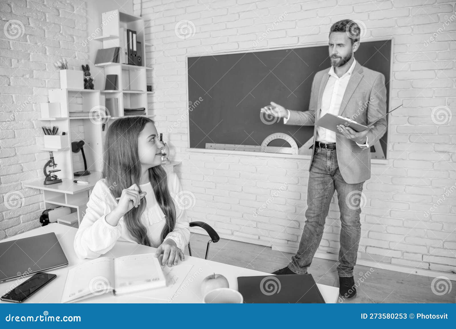 Positive Child Study in Classroom with Teacher. Selective Focus Stock ...