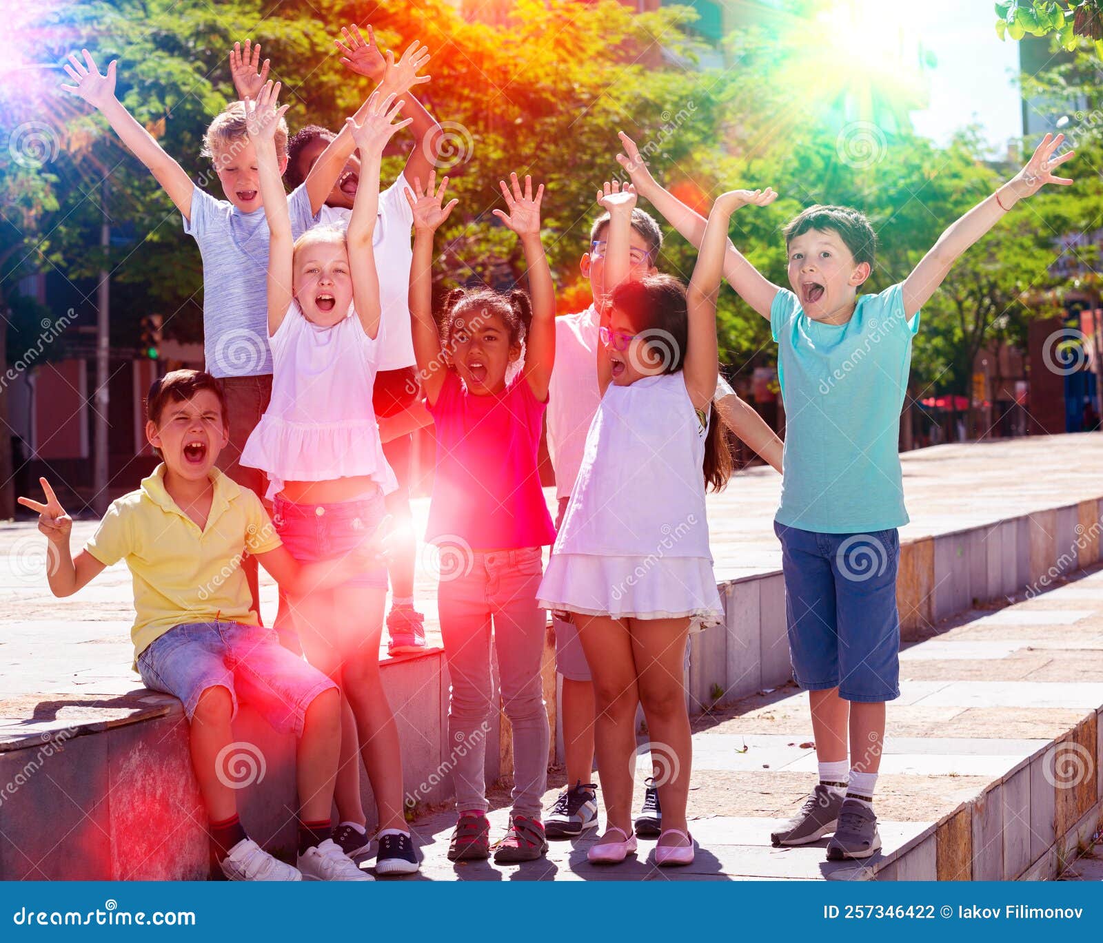 Positive Children Holding Hands Up and Smiling Together in Park Stock ... Positive Children Holding Hands Up and Smiling Together in Park Stock ...