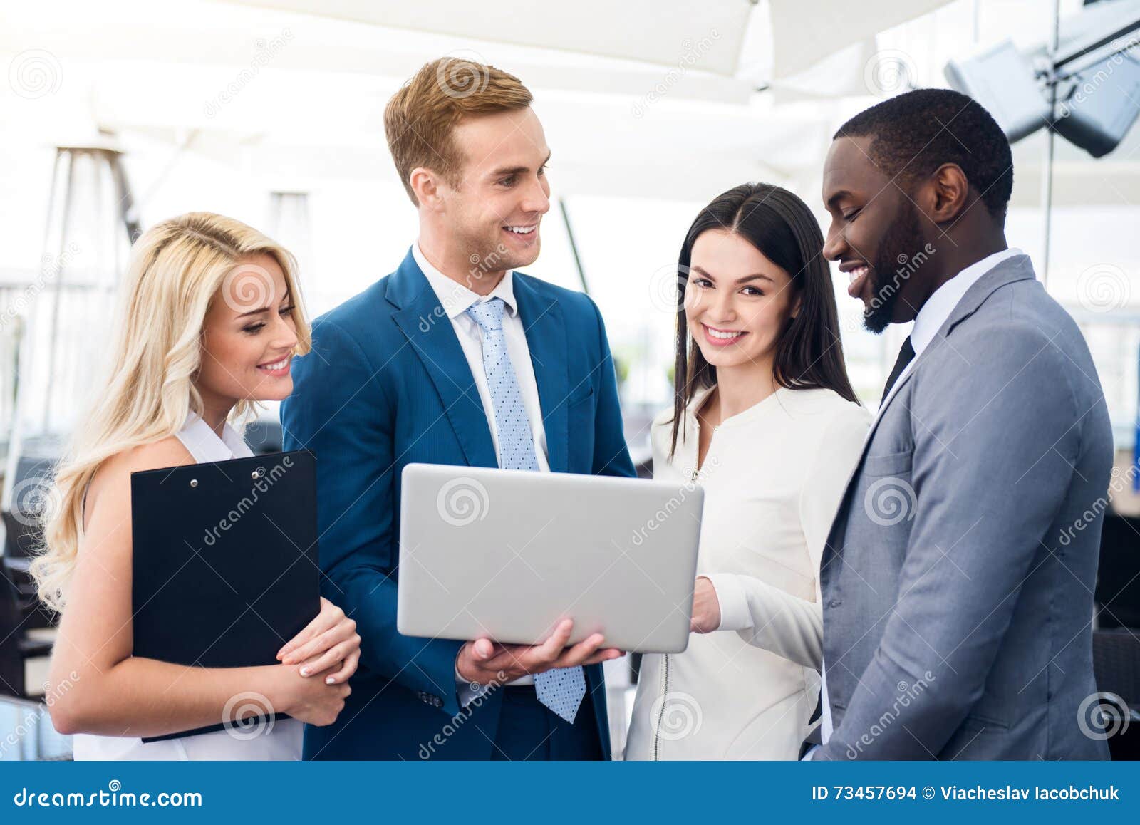 Positive Colleagues Discussing Project Stock Photo - Image of ...