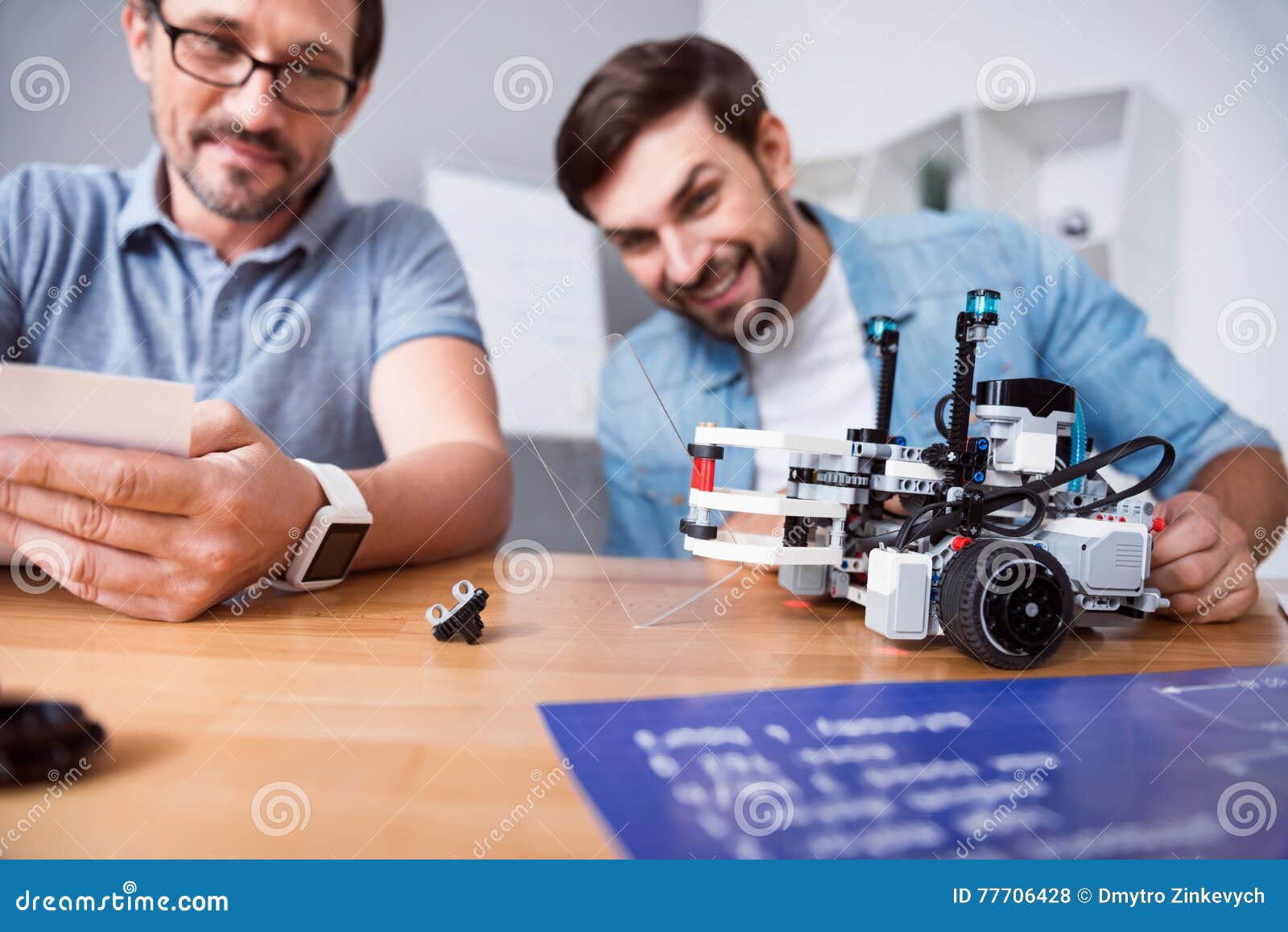 Positive Colleagues Working with Robot Stock Photo - Image of robotics ...