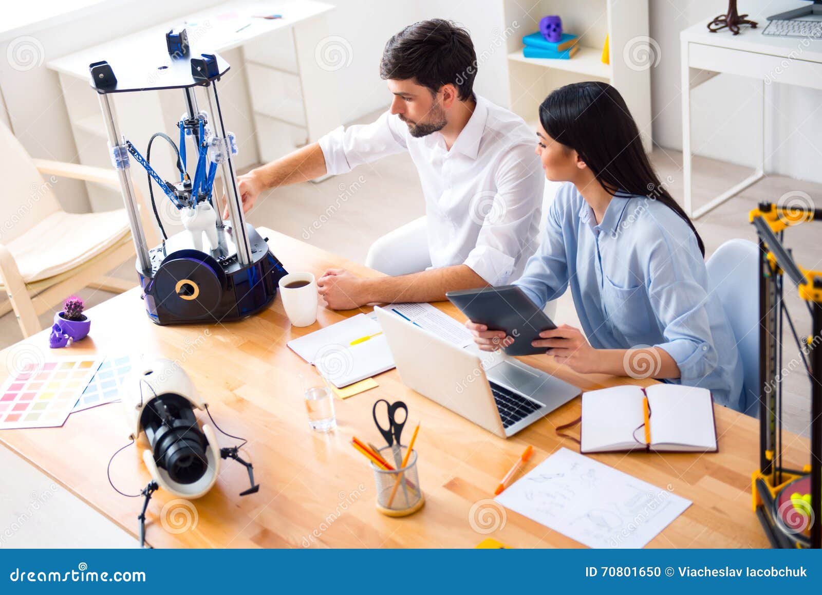 Positive Colleagues Working at the Table Stock Photo - Image of device ...