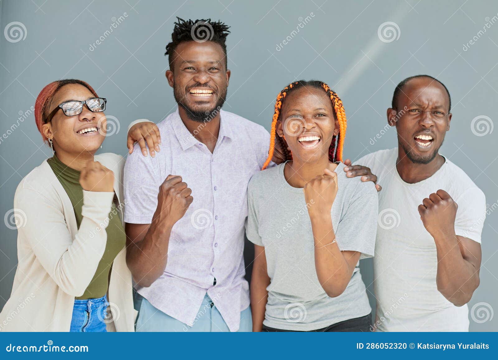 Positive Corporate Team Posing while Looking at the Camera Stock Photo ...