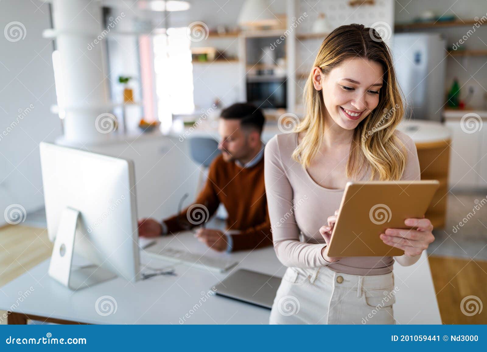 Positive Couple Having Fun while Working Together Remotely at Home ...