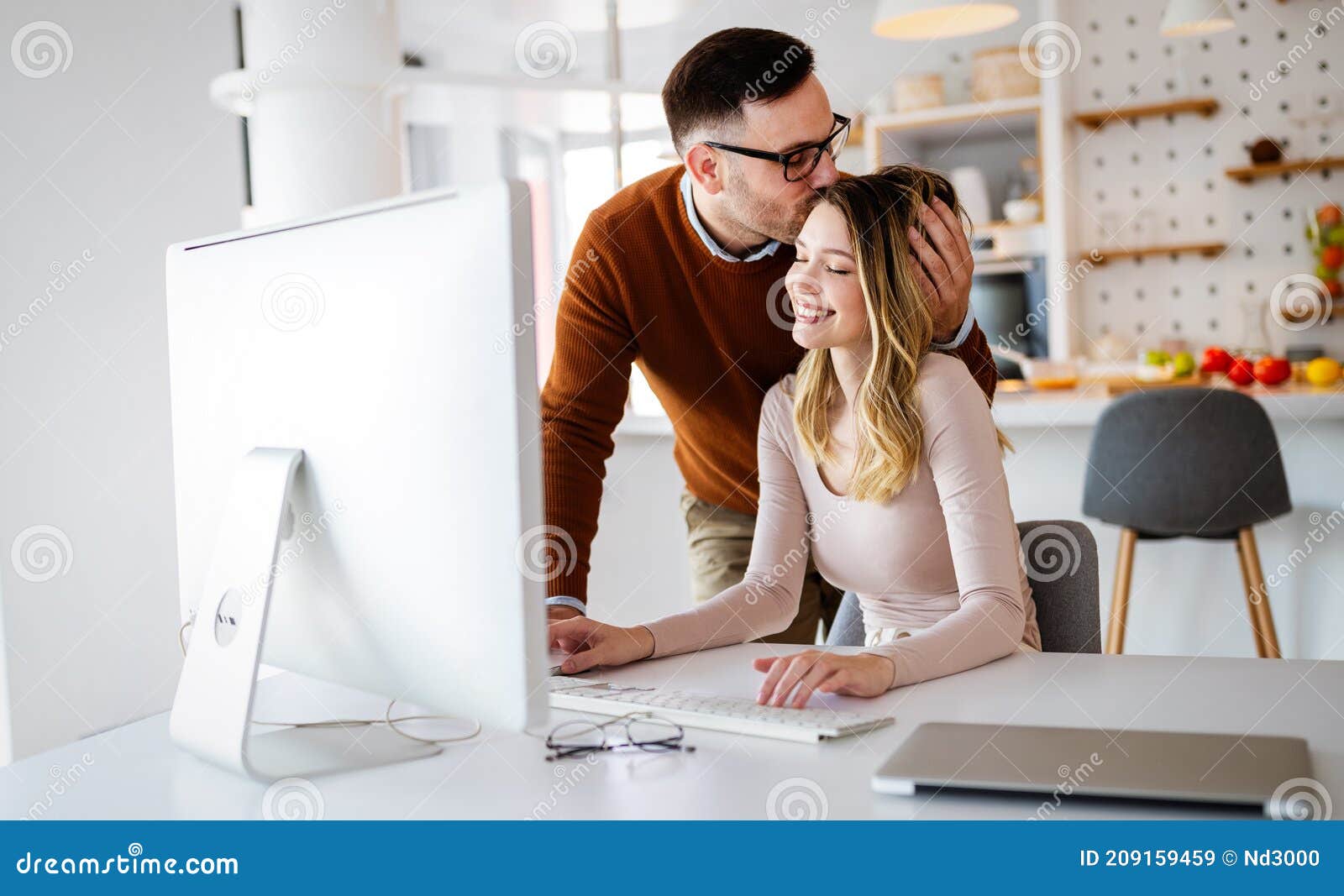 Positive Couple Having Fun while Working Together Remotely at Home ...
