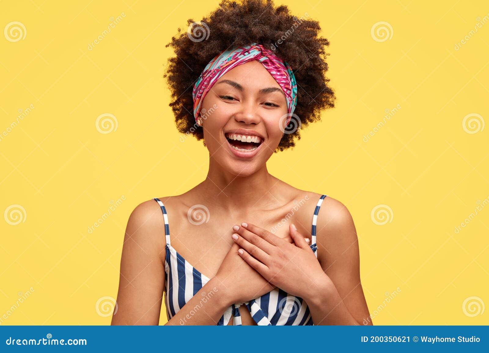 Positive Dark Skinned Young Woman With Pleased Expression Feels