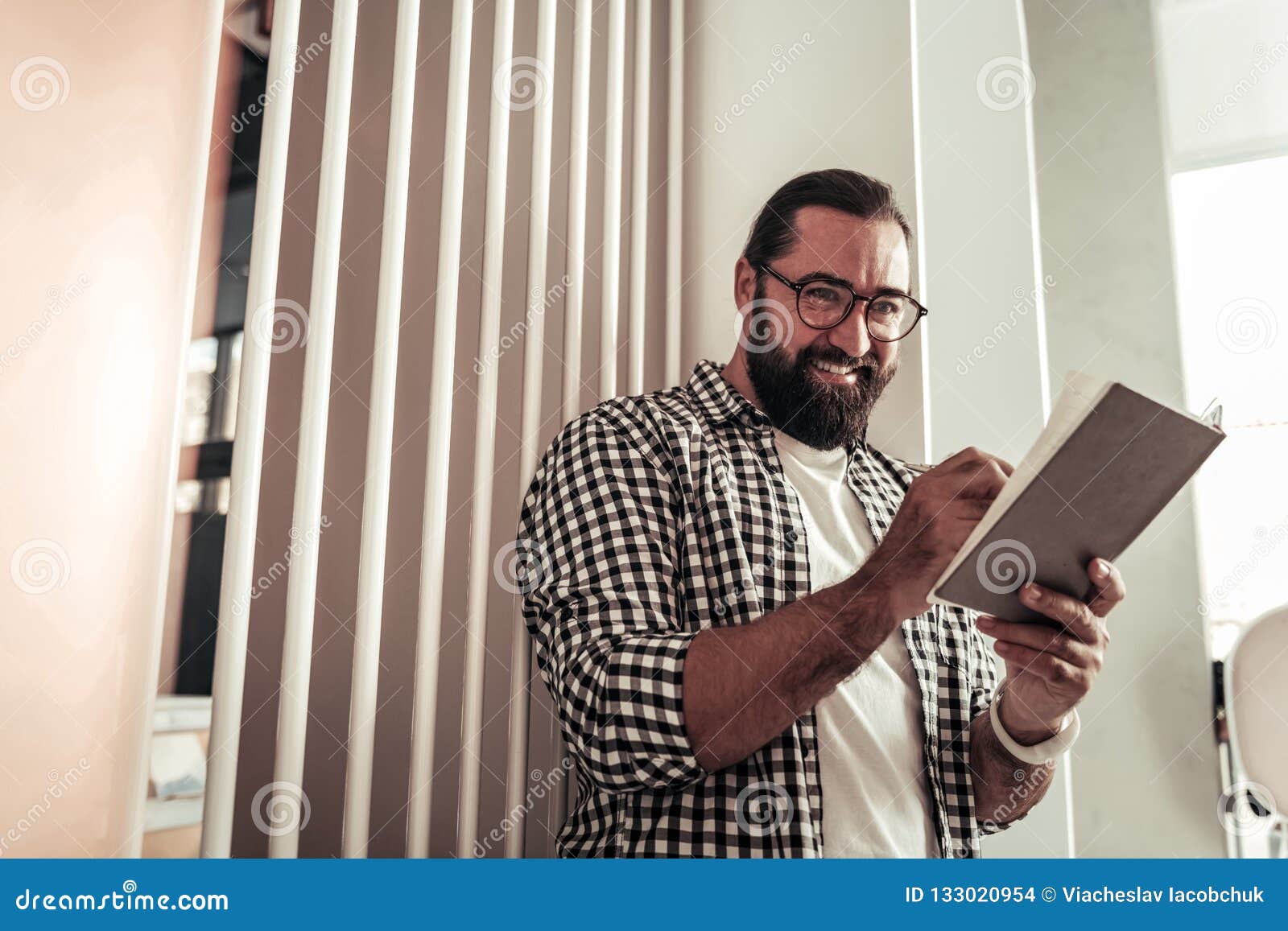 Positive Delighted Man Writing Down His Ideas Stock Photo - Image of ...