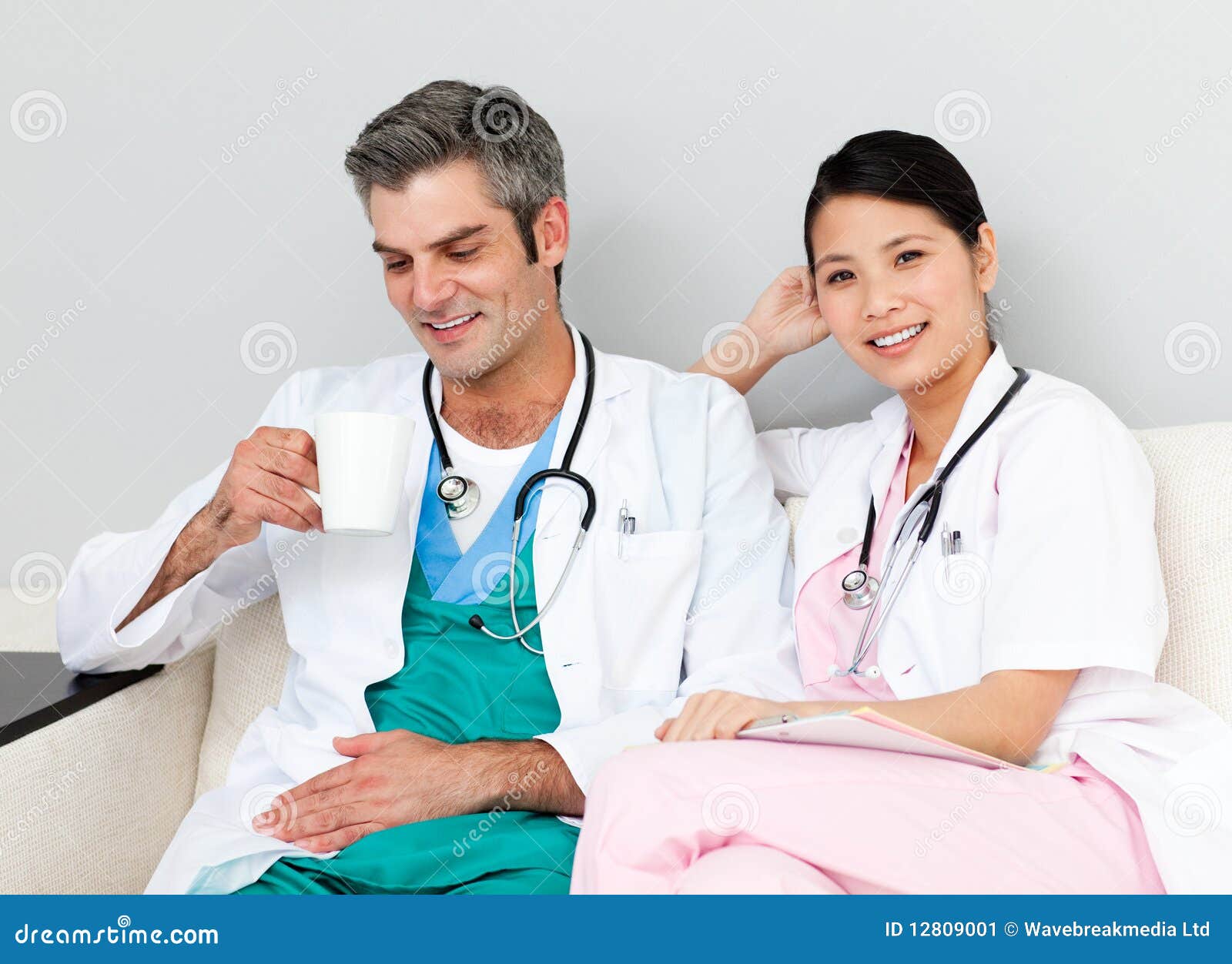 Positive Doctors Relaxing and Drinking Coffee Stock Image - Image of ...