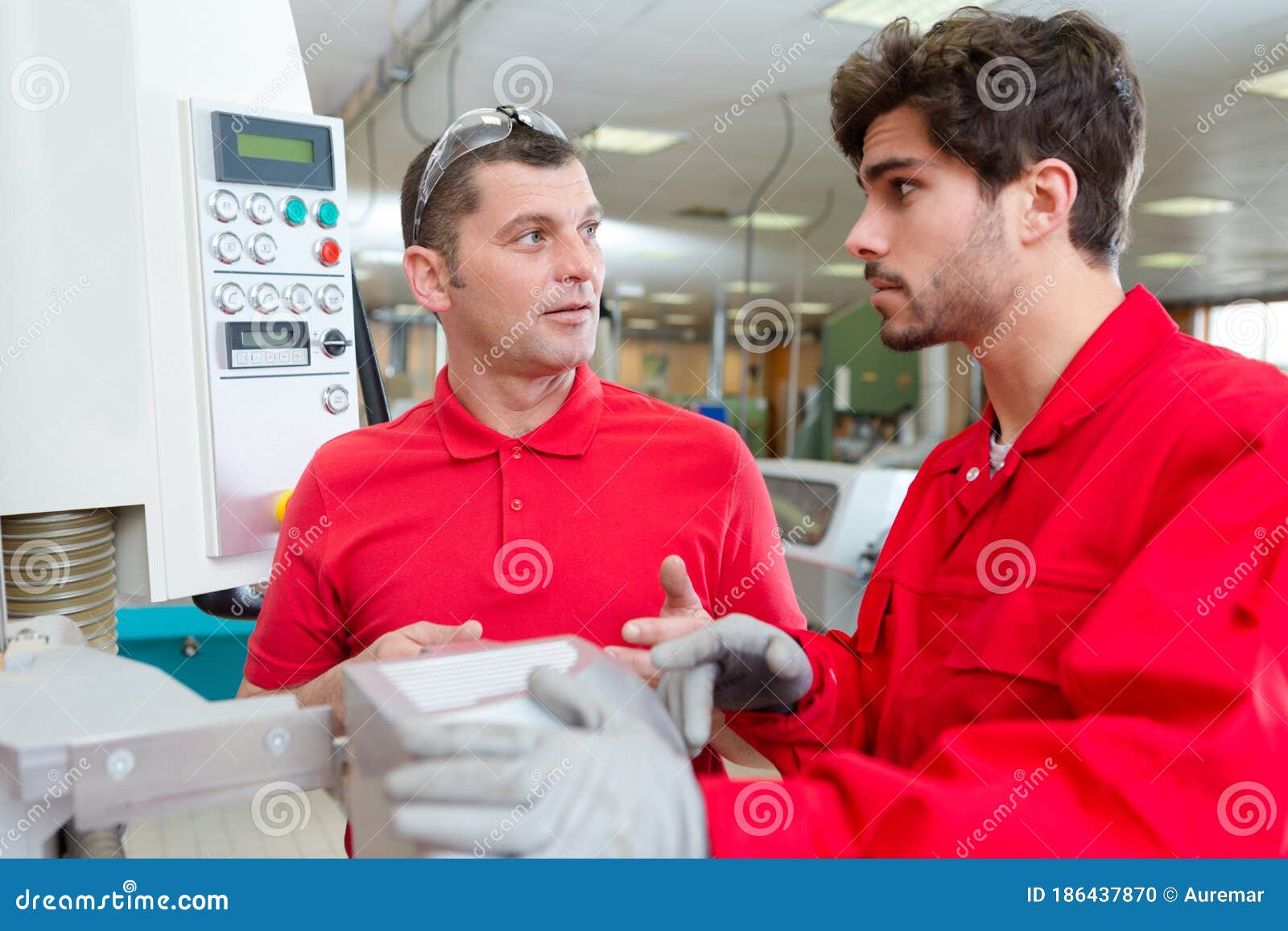 Positive Employes Working on Machine in Factory Stock Photo - Image of ...