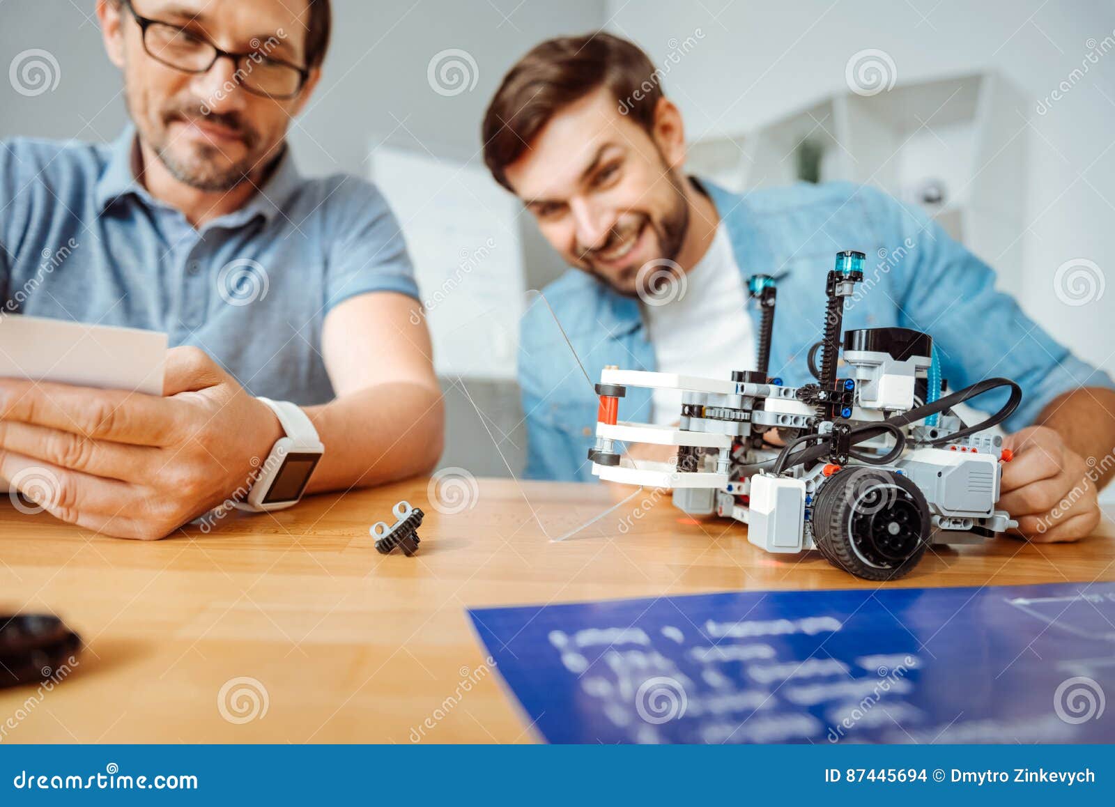Positive Engineers Testing the Robot Stock Photo - Image of inventor ...