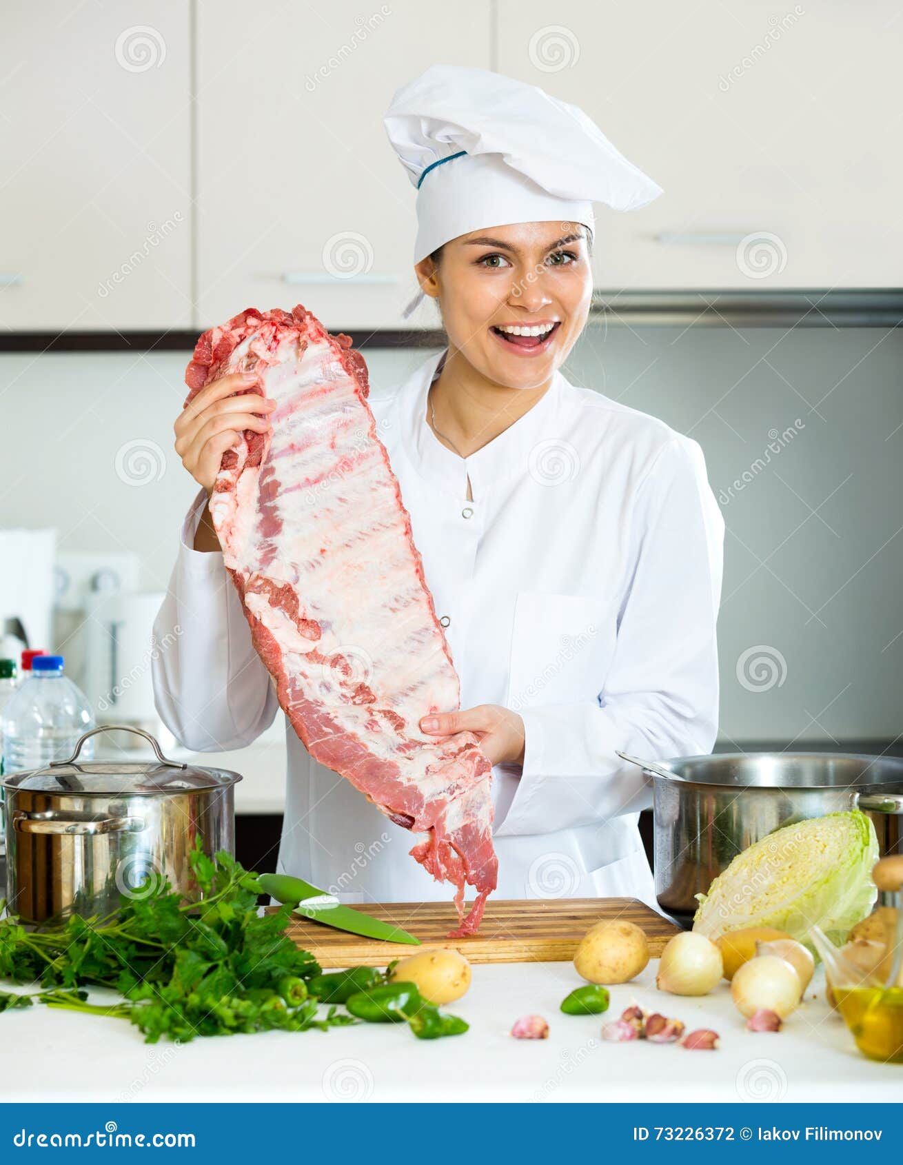 Positive Female Chef Working with Pork Ribs Stock Photo - Image of ...