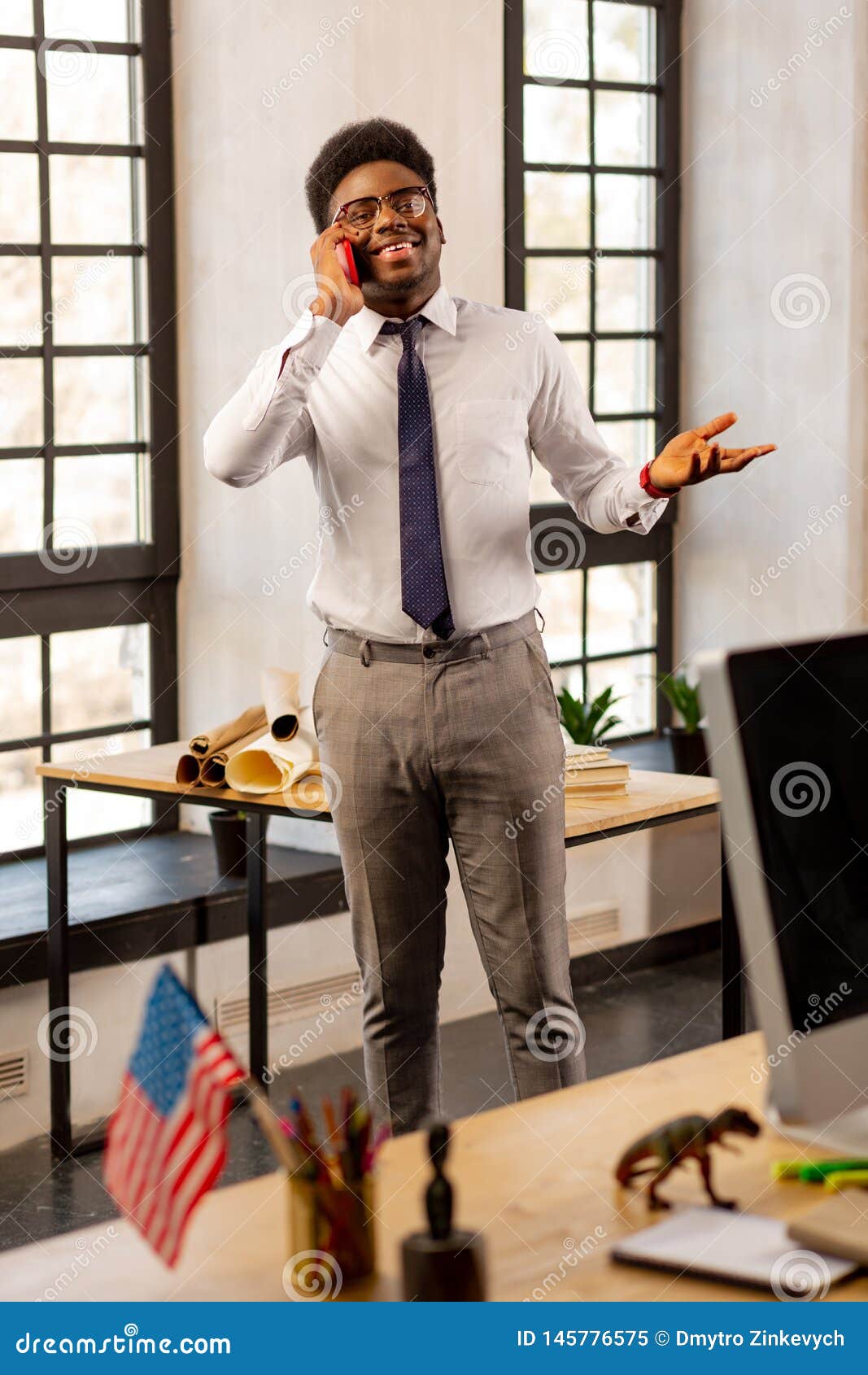 Positive Friendly Man Reading an Agreement with His Client Stock Image ...