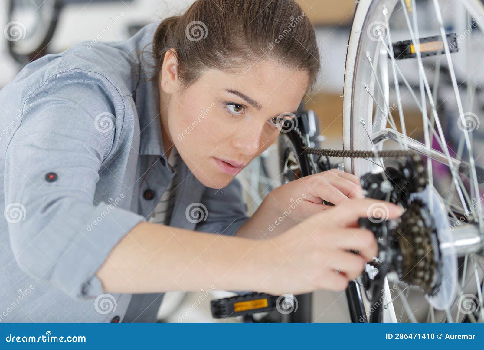 Positive Girl Fixing Wheels in Workshop Stock Photo - Image of repair ...