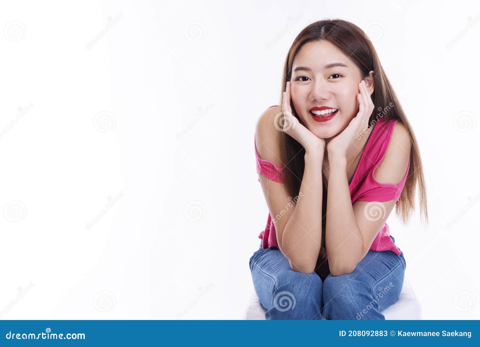 Positive Girl Hipster Smiling Keep Her Hand Under Chin While Sitting Over Isolated White