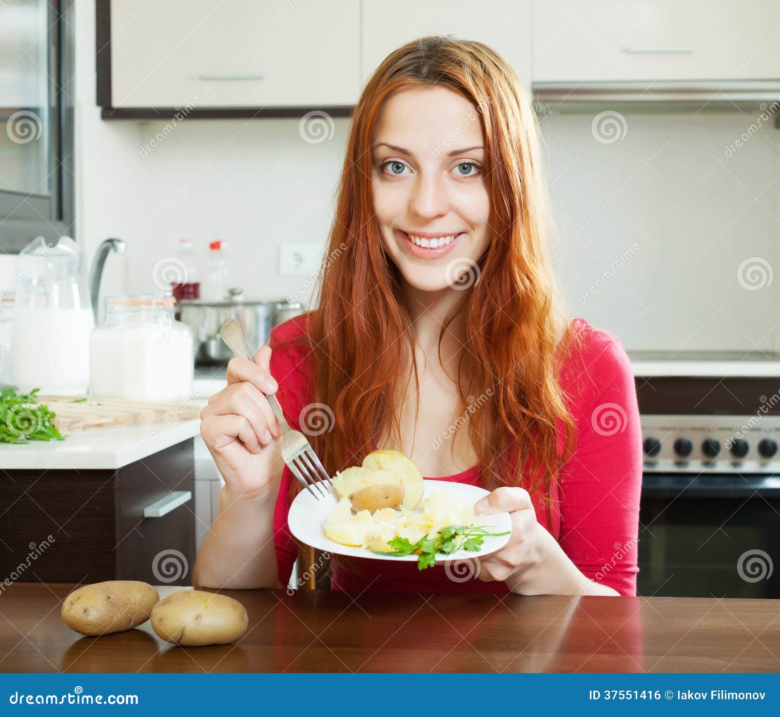 Positive Girl in Red Eating Jacket Potatoes Stock Photo - Image of ...