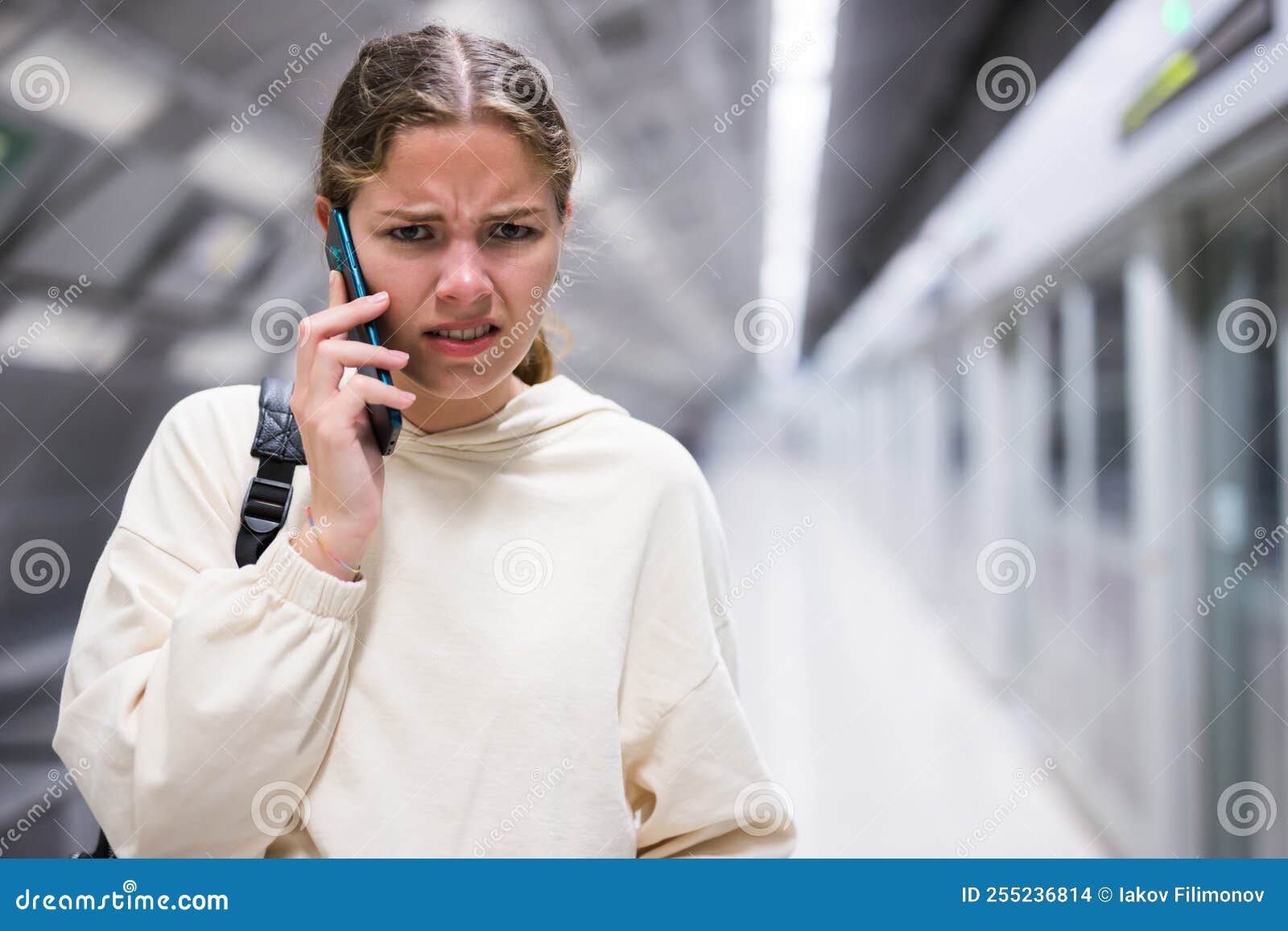 Positive Girl in the Subway Communicates on a Mobile Phone Stock Photo ...
