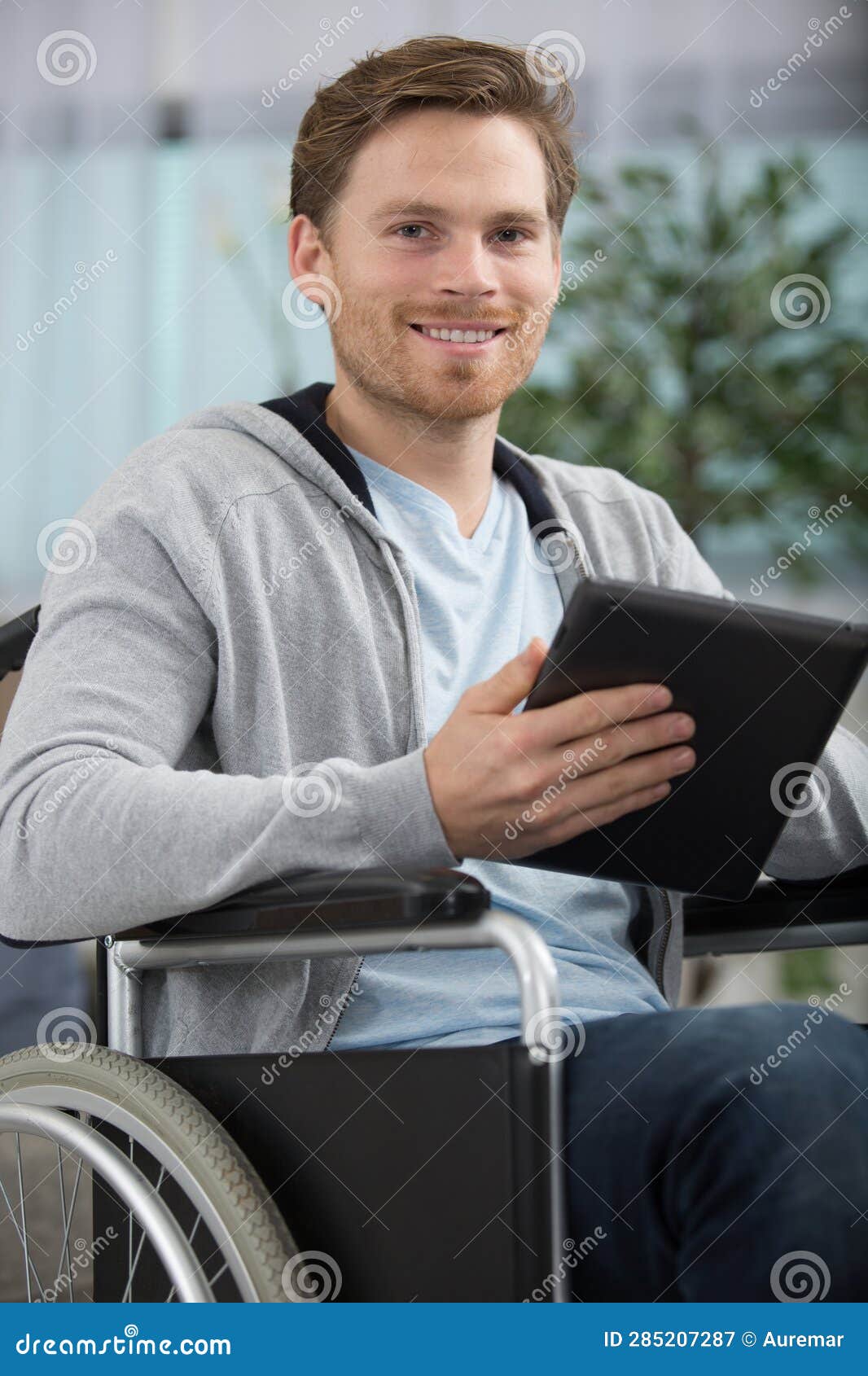 Positive Handsome Disabled Man Holding Tablet Stock Image - Image of ...