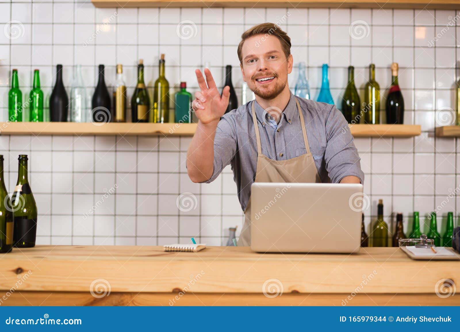 Positive Handsome Man Standing at the Counter Stock Photo - Image of ...