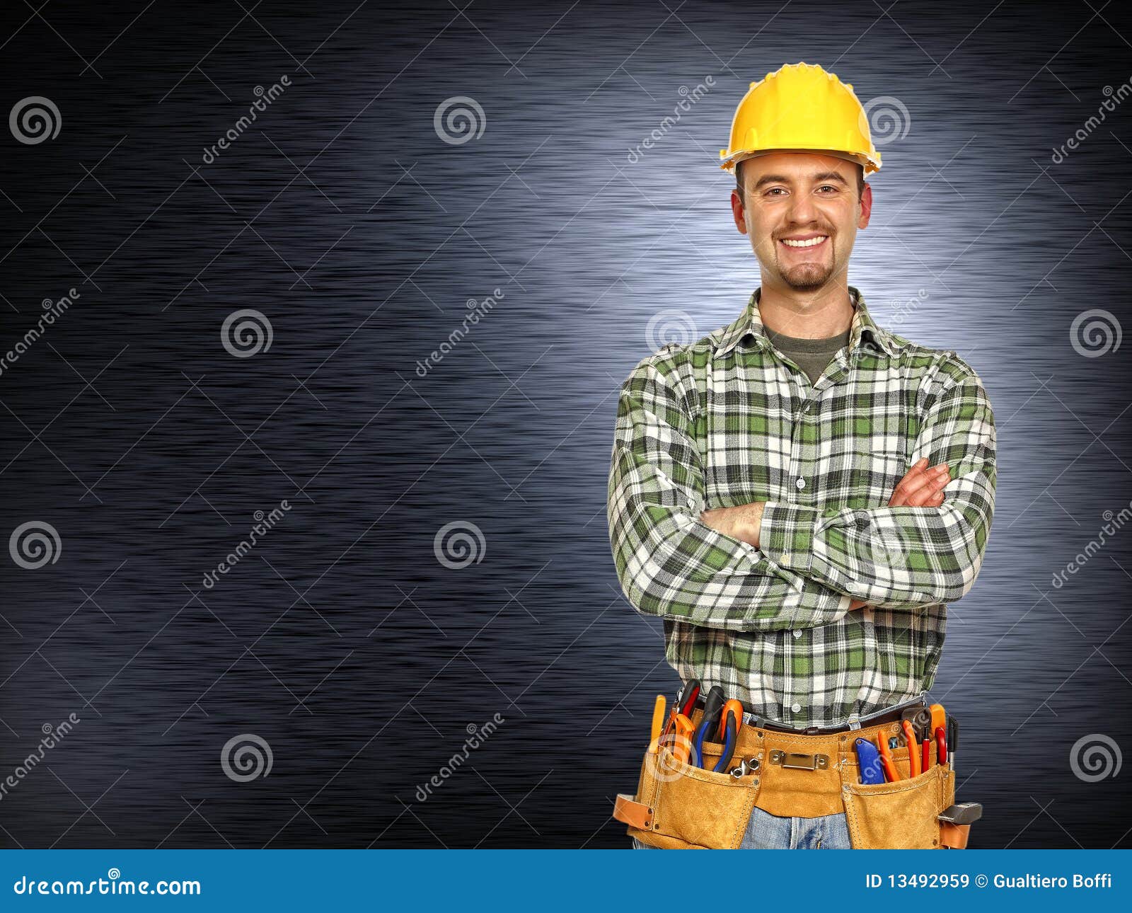 Positive handyman smiling stock image. Image of brushed - 13492959