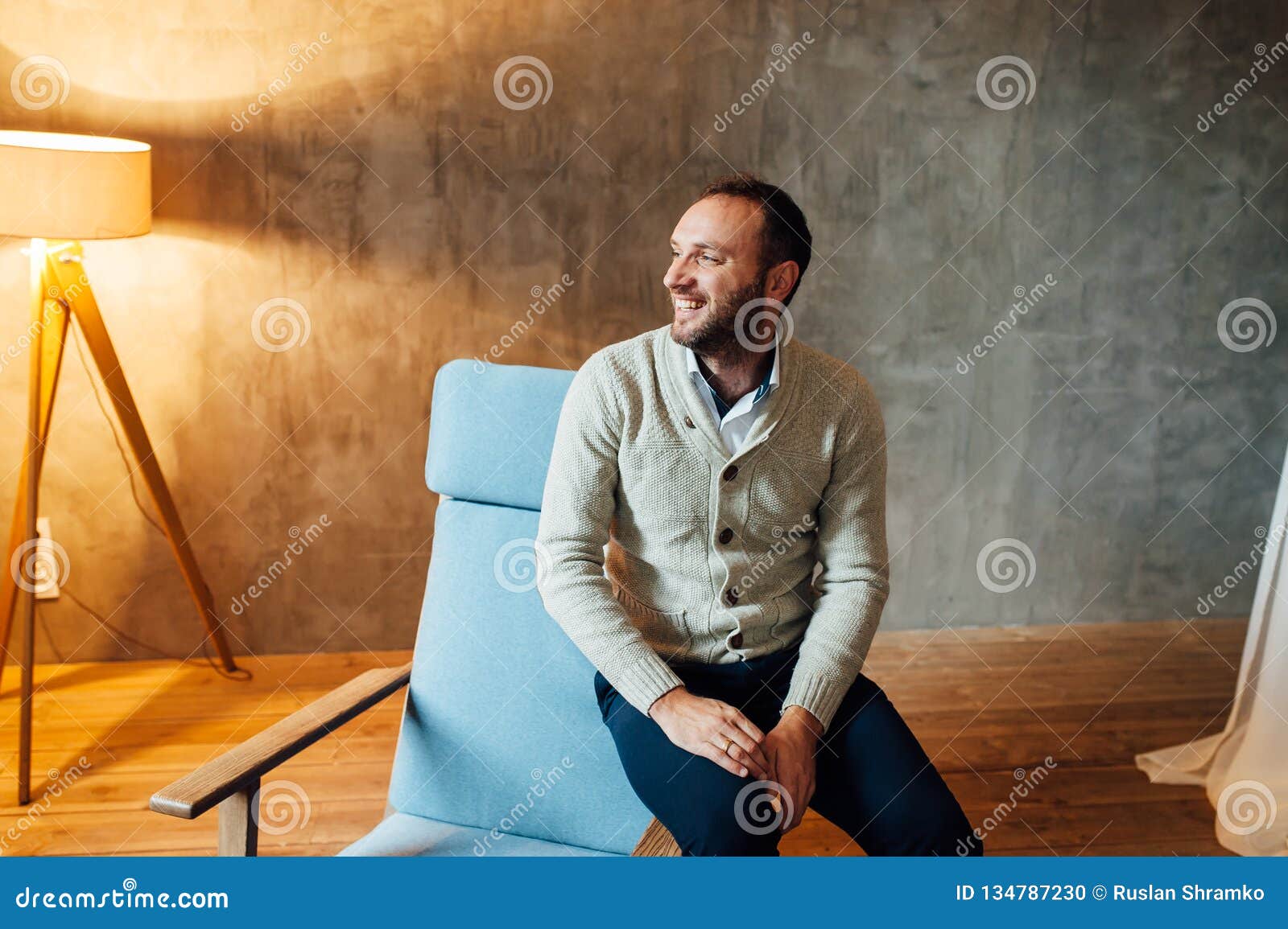 Positive Happy Man Smiling in Room with Lamp Stock Photo - Image of ...