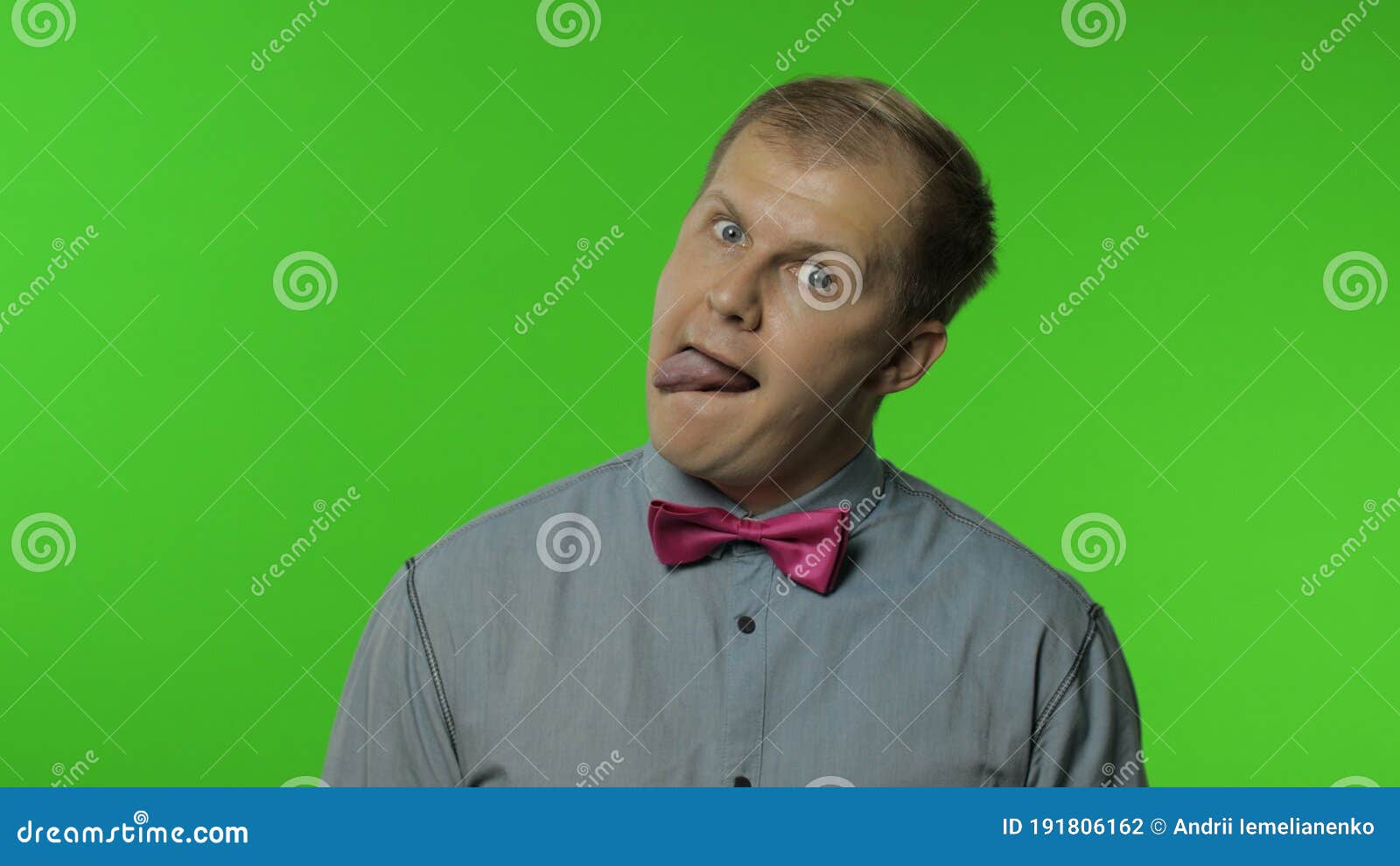 Positive Man Having Fun In Front Of Camera Showing Tongue Out