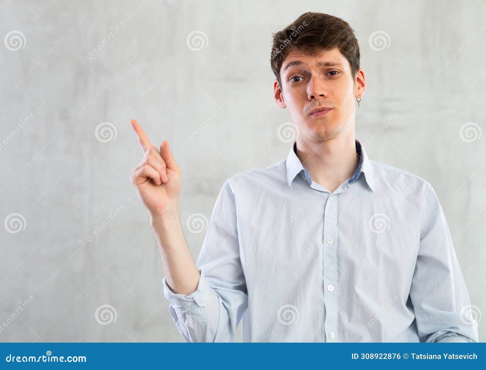 Positive Man Pointing with His Hand at Something - Advertising Concept ...