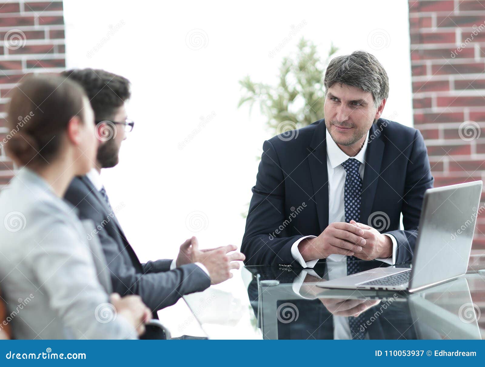 Positive Manager with His Team Sitting at the Table Stock Image - Image ...
