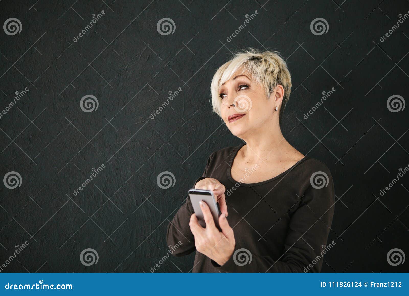 A Positive Modern Elderly Woman Holds A Tablet In Her Hands And Uses It ...