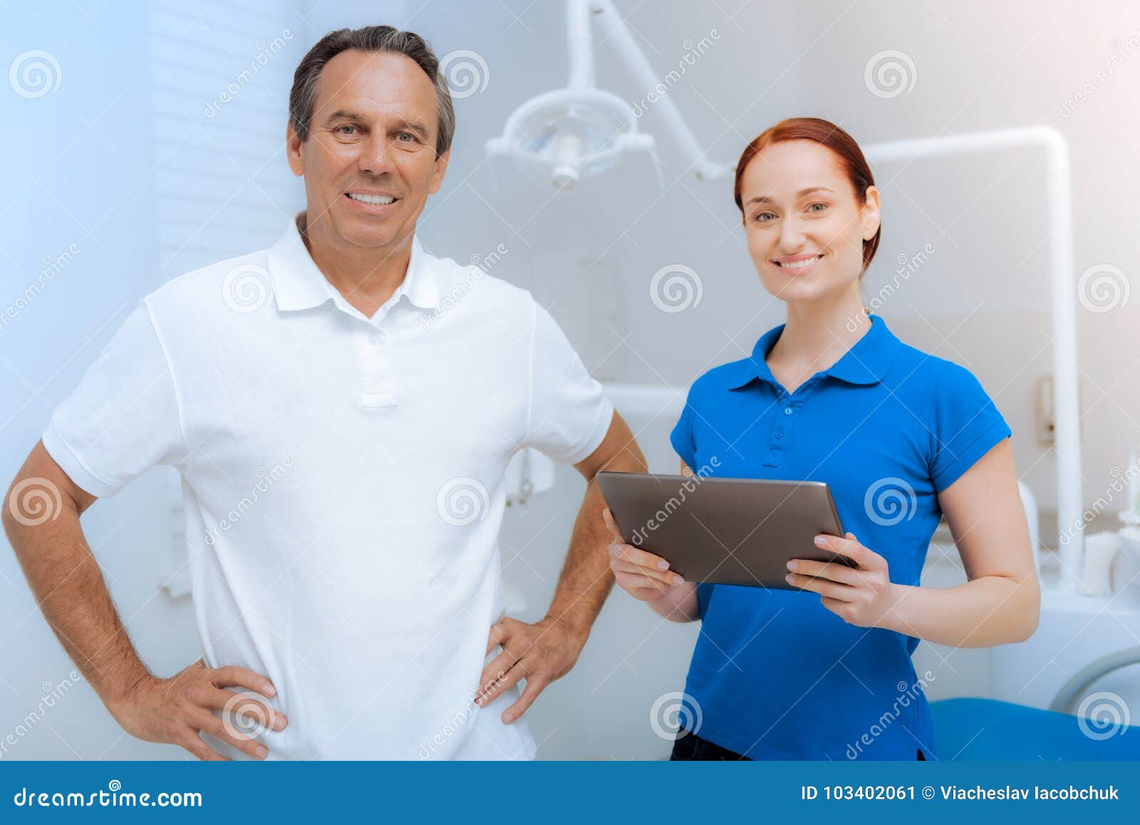 Positive Nice Intern Holding a Tablet Stock Image - Image of ache ...