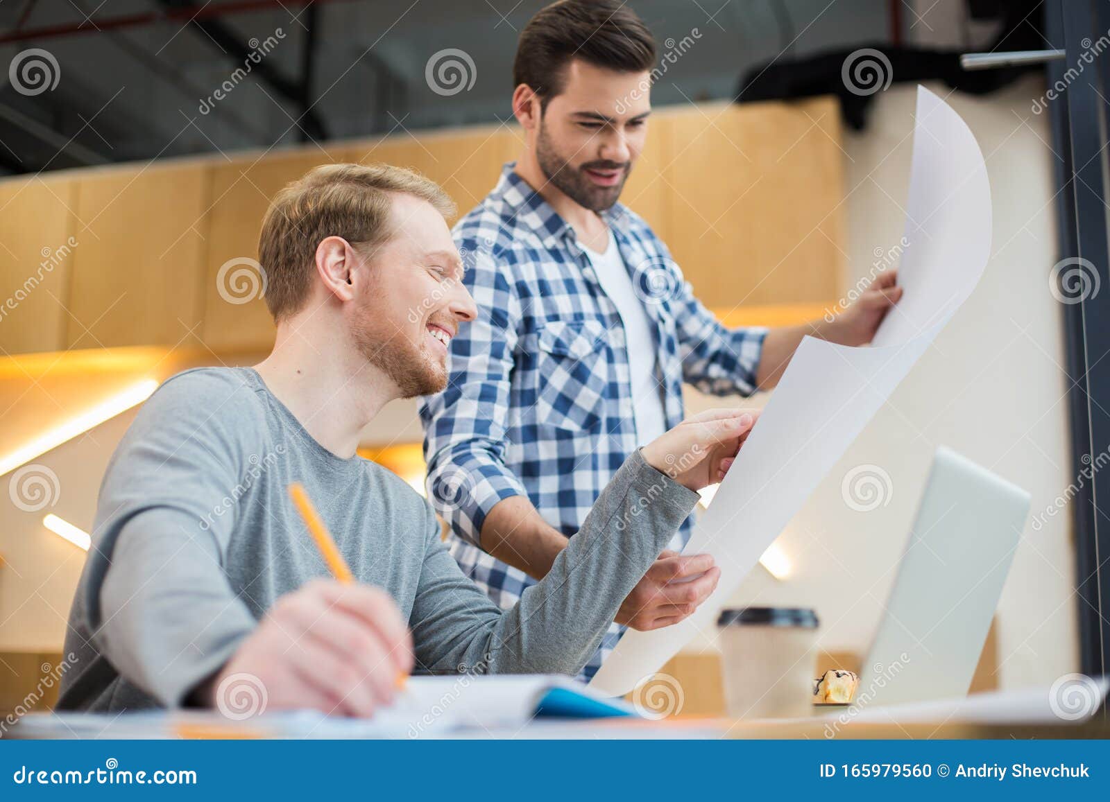 Positive Nice Man Looking at the Drawing Stock Photo - Image of ...