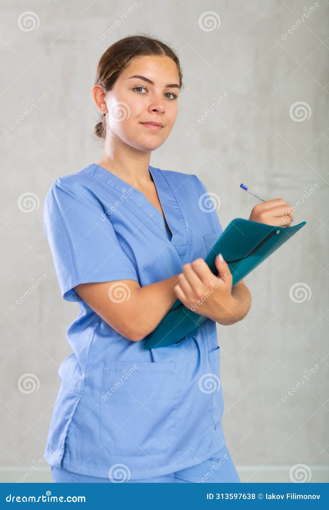 Positive Nurse Filling Out Medical History Forms in Documents Stock ...
