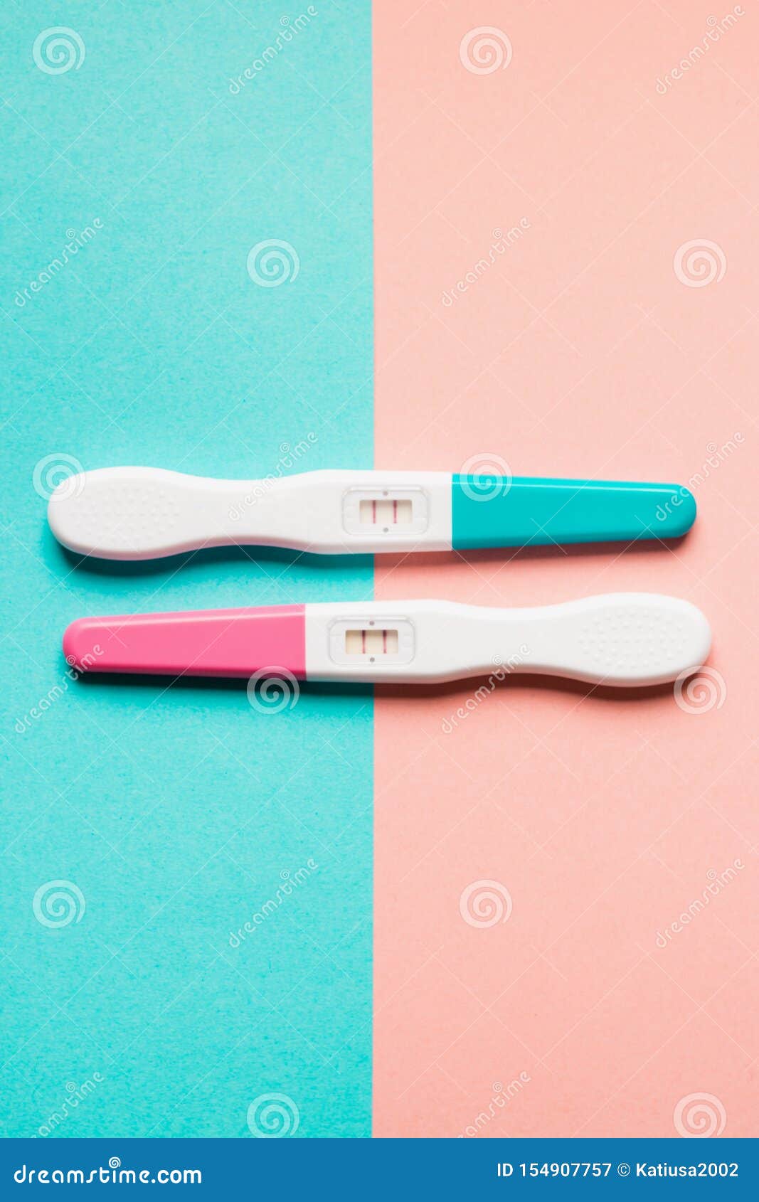 Positive Pink and Blue Plastic Pregnancy Test on Pink Background Stock ...
