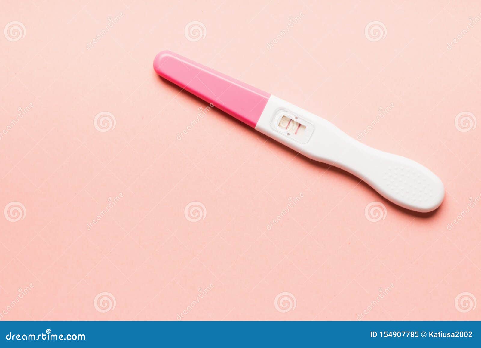 Positive Pink Plastic Pregnancy Test on Pink Background Stock Image ...