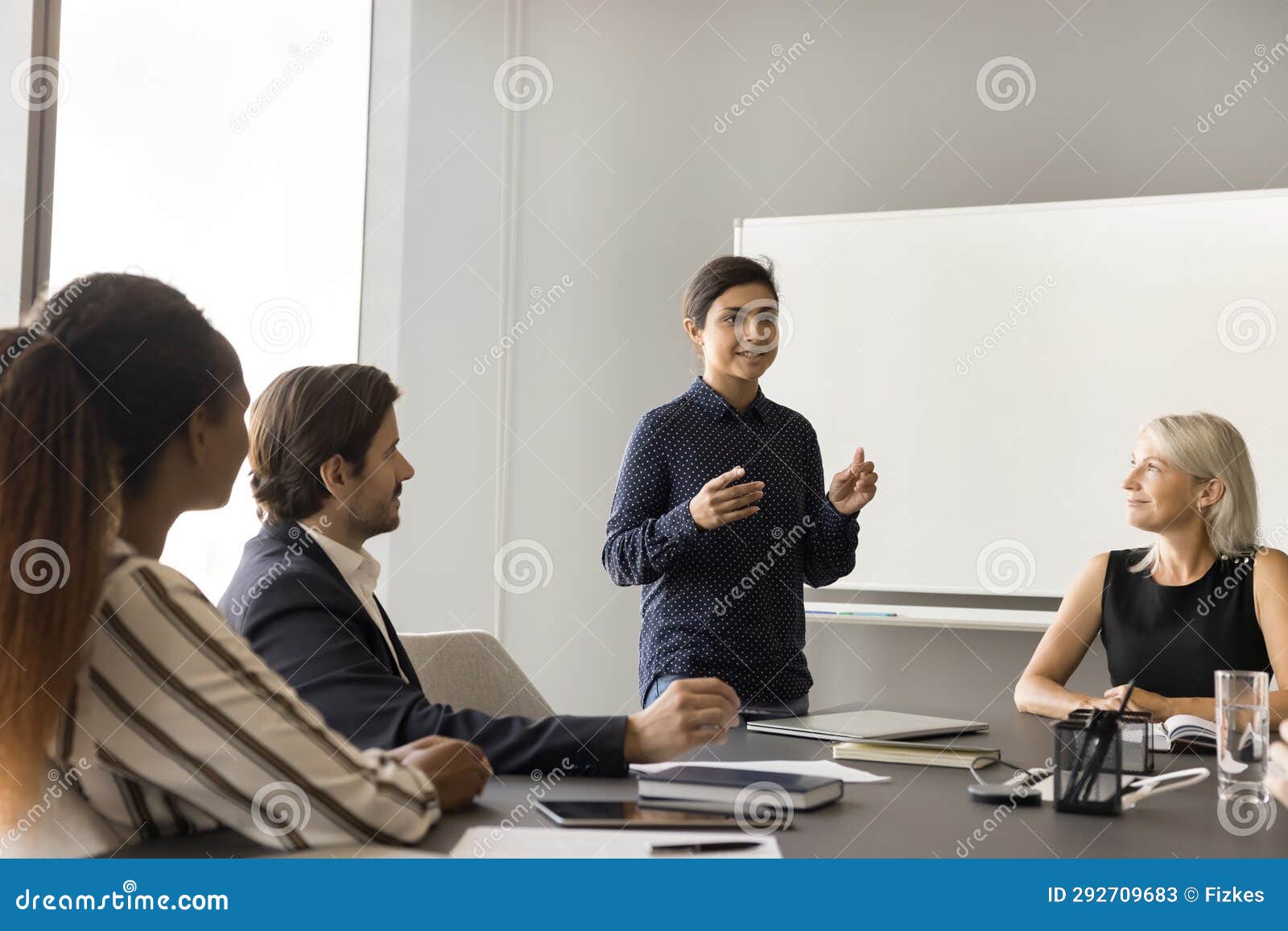 Positive Pretty Young Indian Speaker Woman Presenting Work Strategy ...