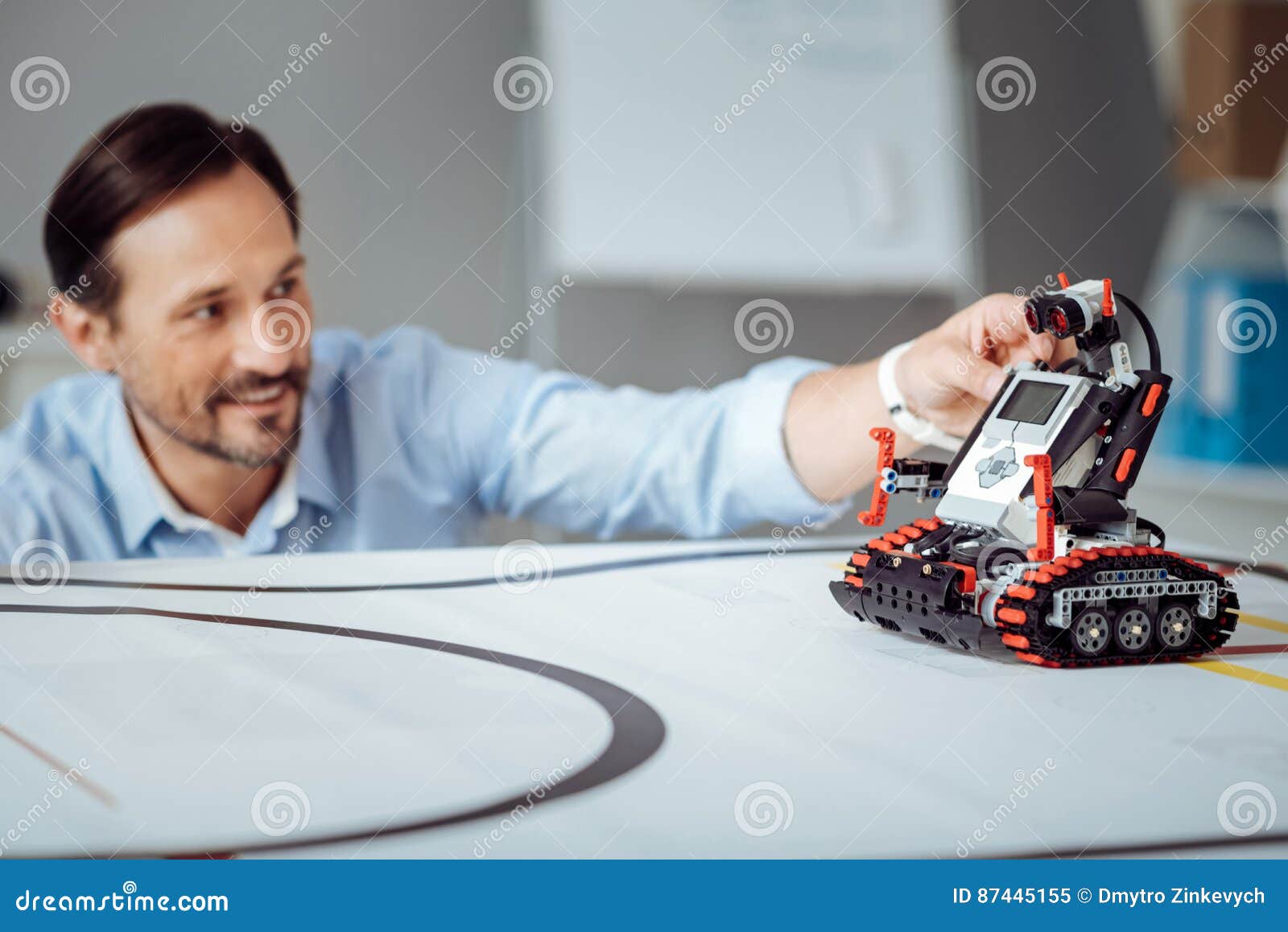 Positive Professional Engineer Testing the Robot Stock Image - Image of ...